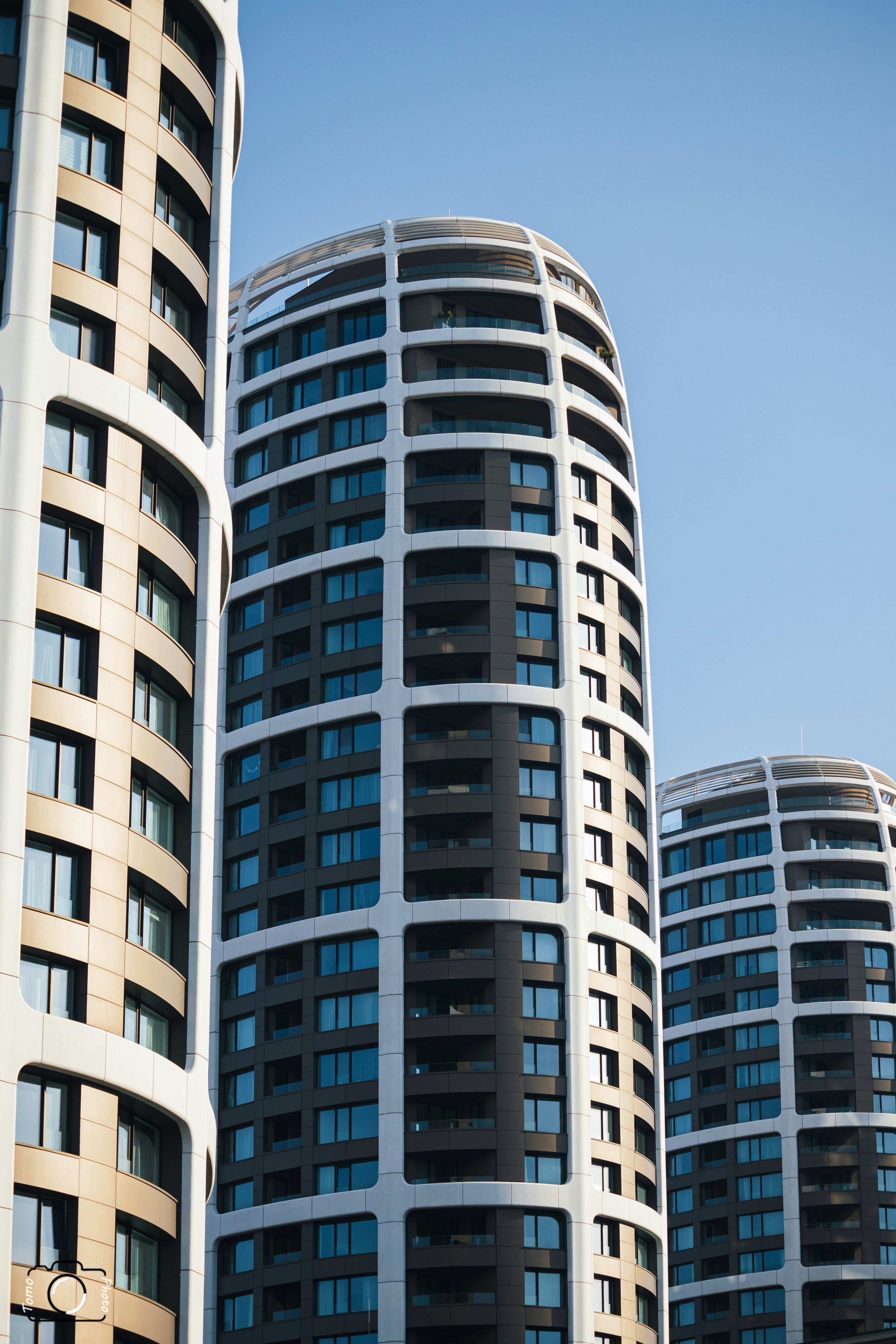 Curved Skyscrapers in Clear Blue Above the City