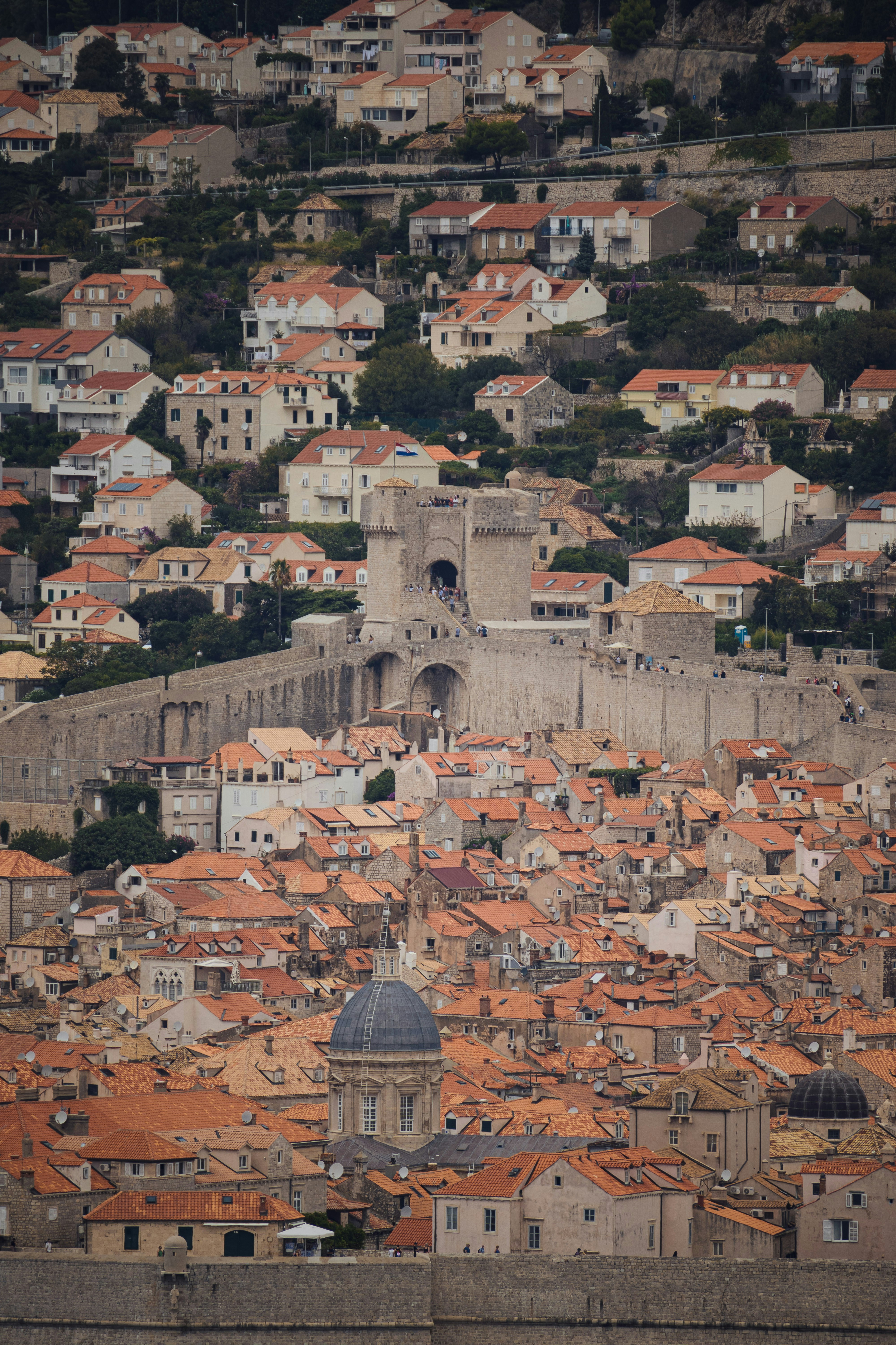 Stone Gate Overlooking a Sea of Terracotta Roofs