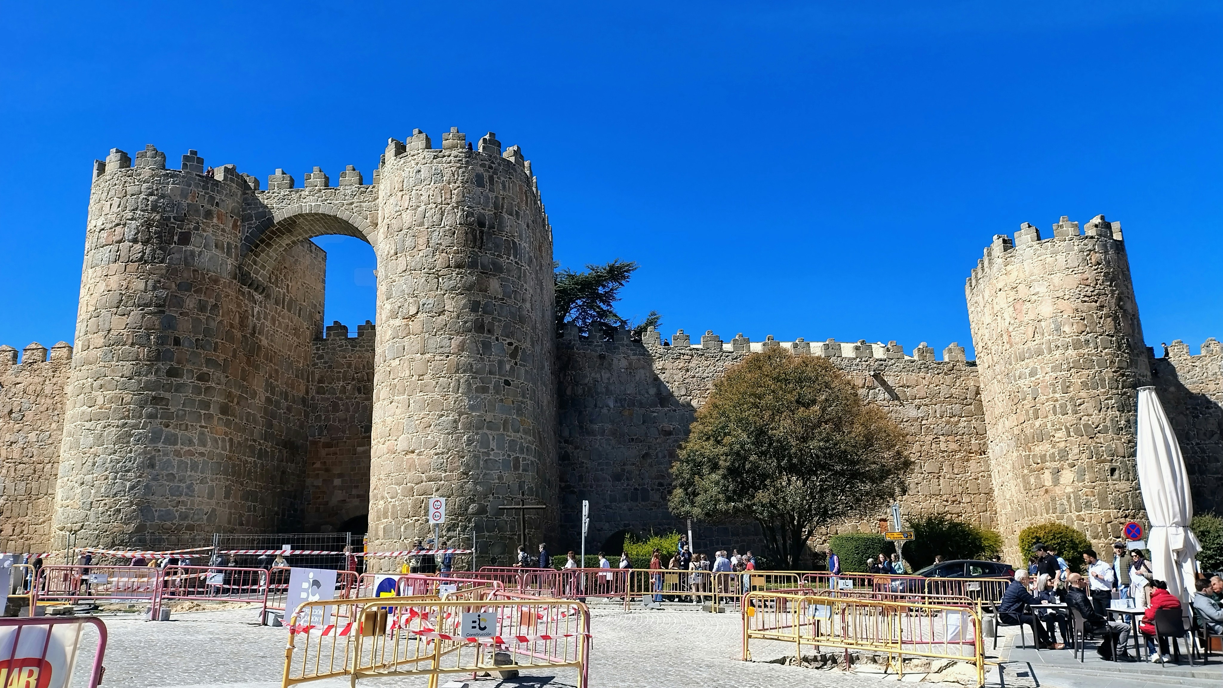 Medieval Gatehouse at Noon: A Fortress Framed by Blue Sky