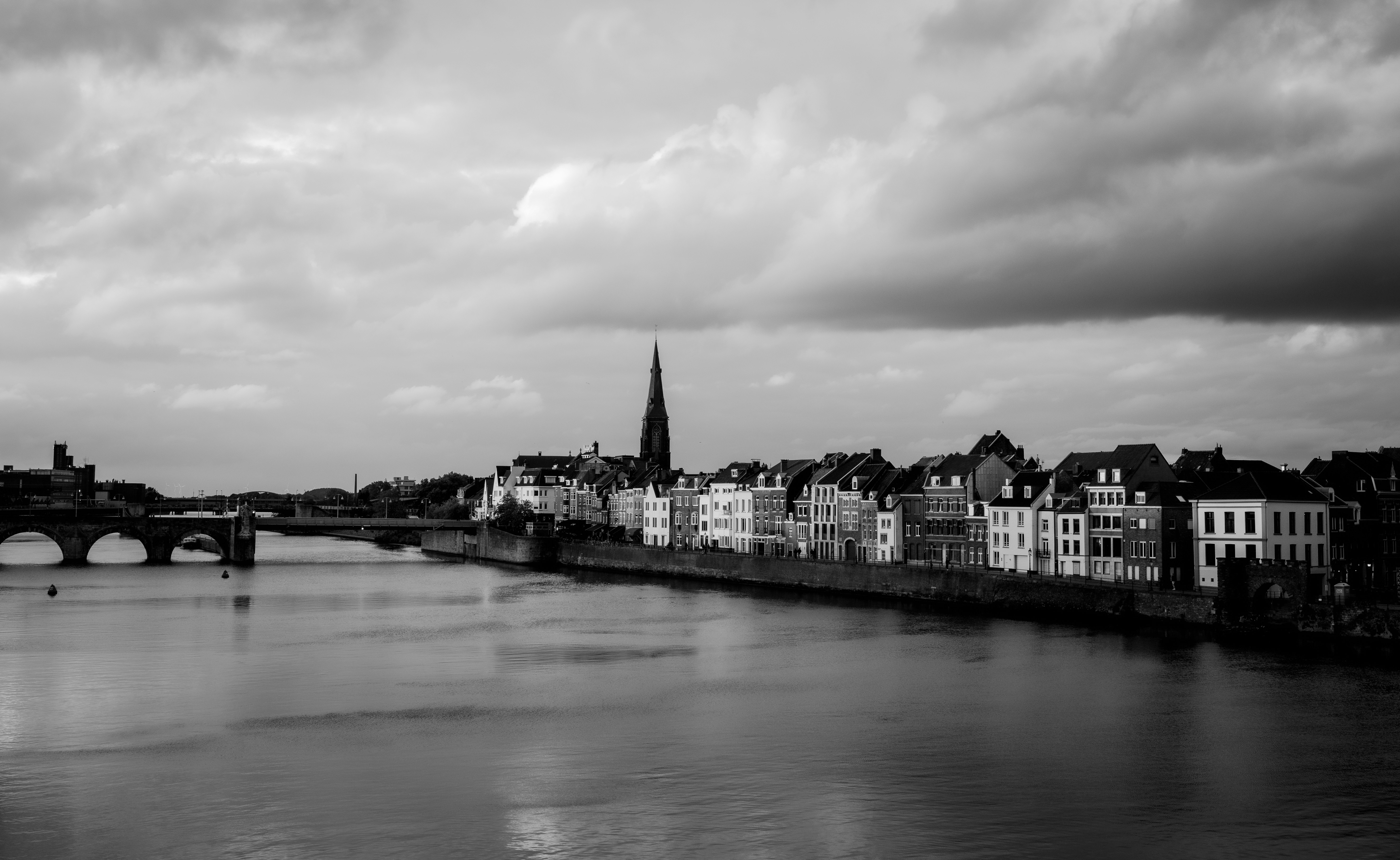 Dusk over the Rivertown: A Quiet Cathedral Spire Above the Waterfront