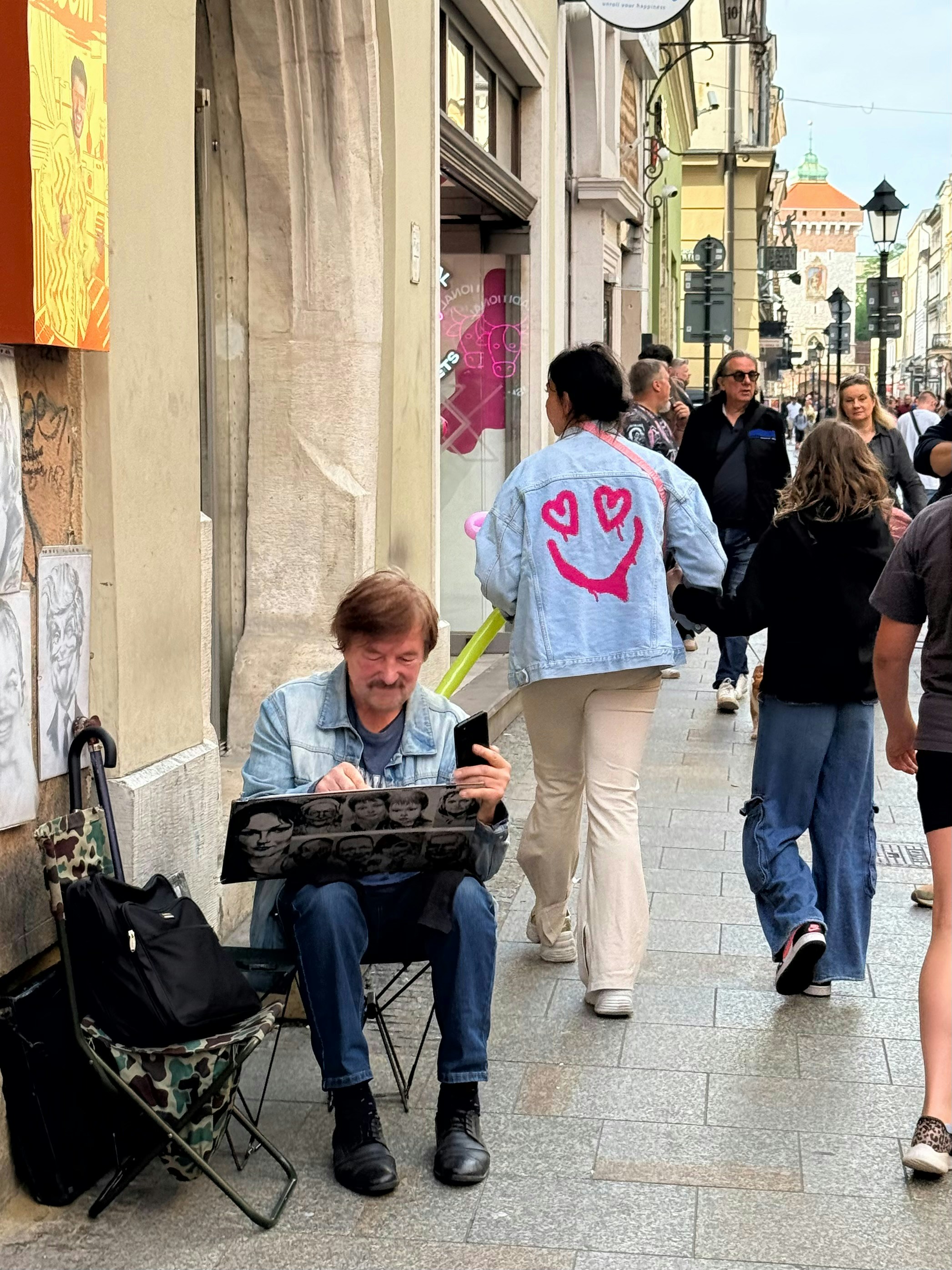 Portrait of a Street Artist Amid a Bustling European Street
