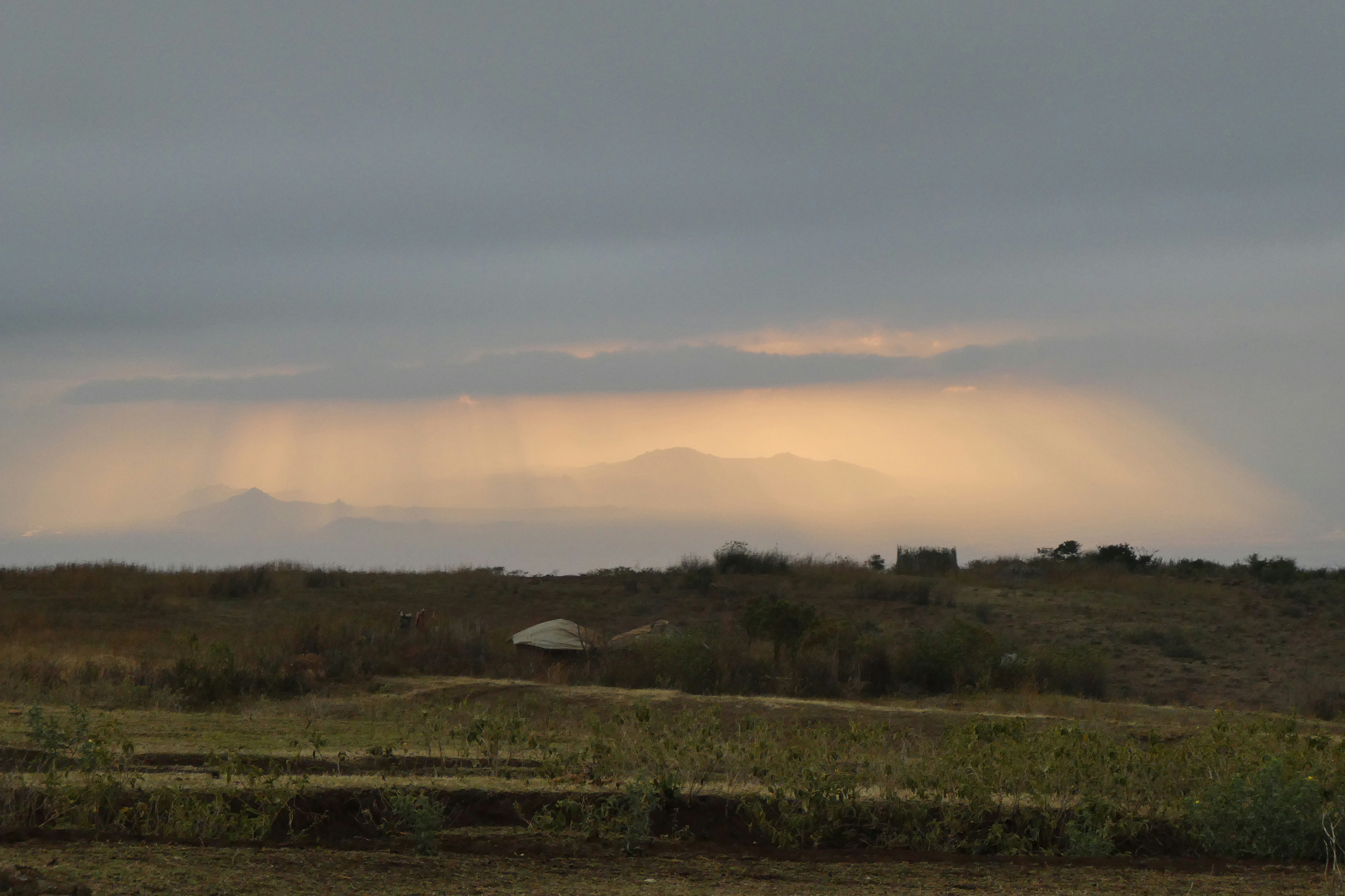Rays Over the Prairie: Distant Hills in Soft Evening Light