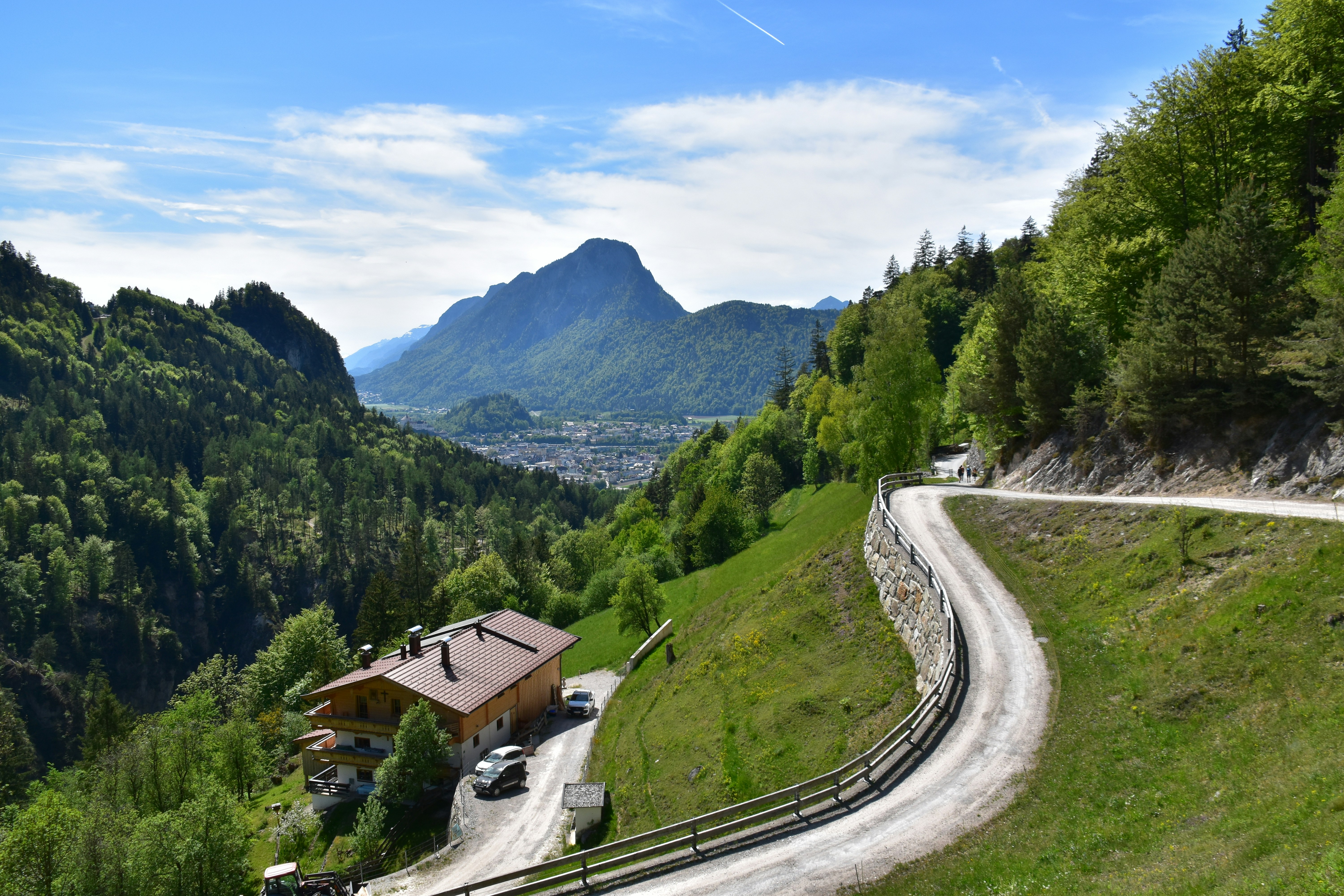 Heritage Chalet on a Winding Alpine Road with a Valley Panorama