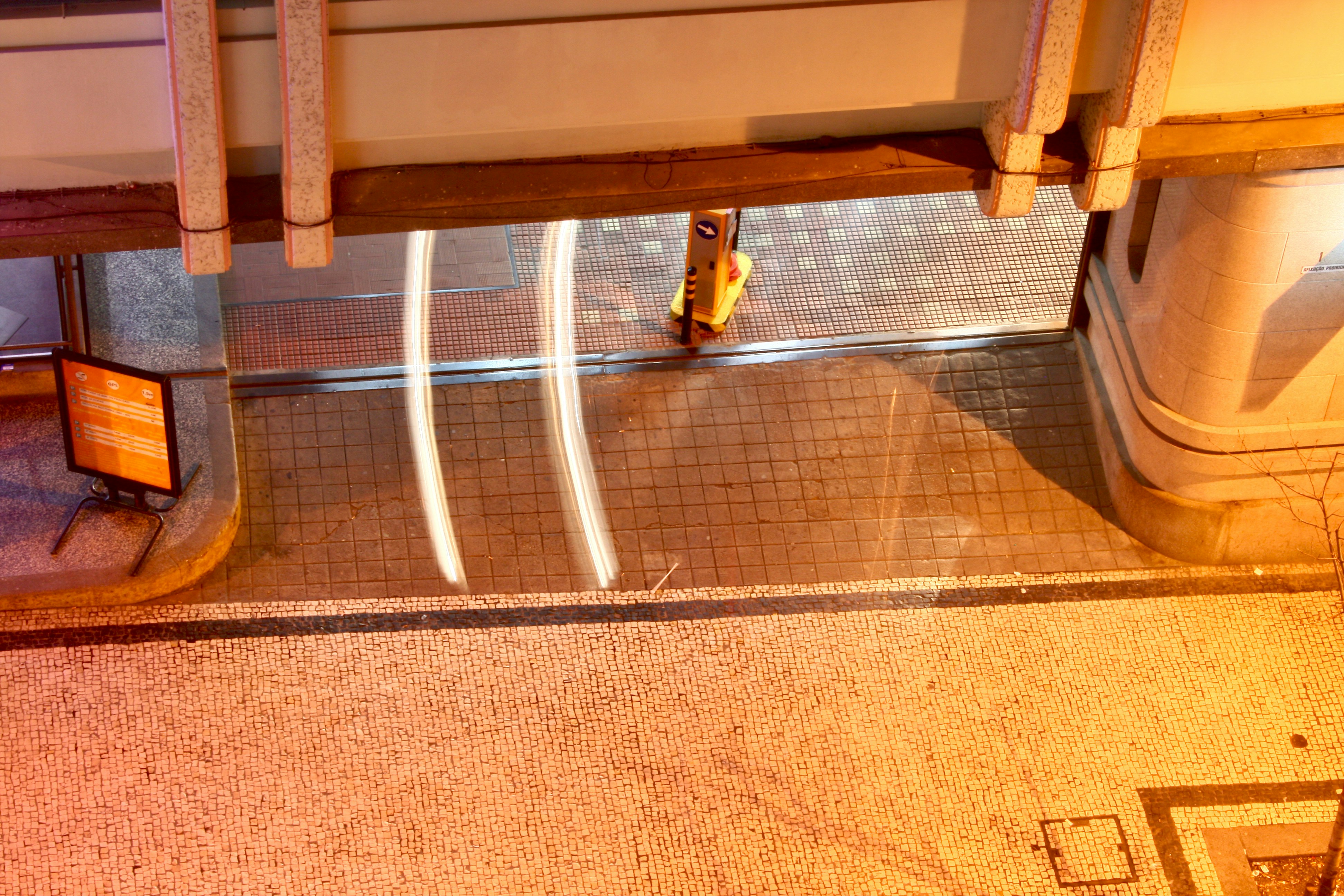Blurred Train Tracks: A Subway Moment in Warm Neon