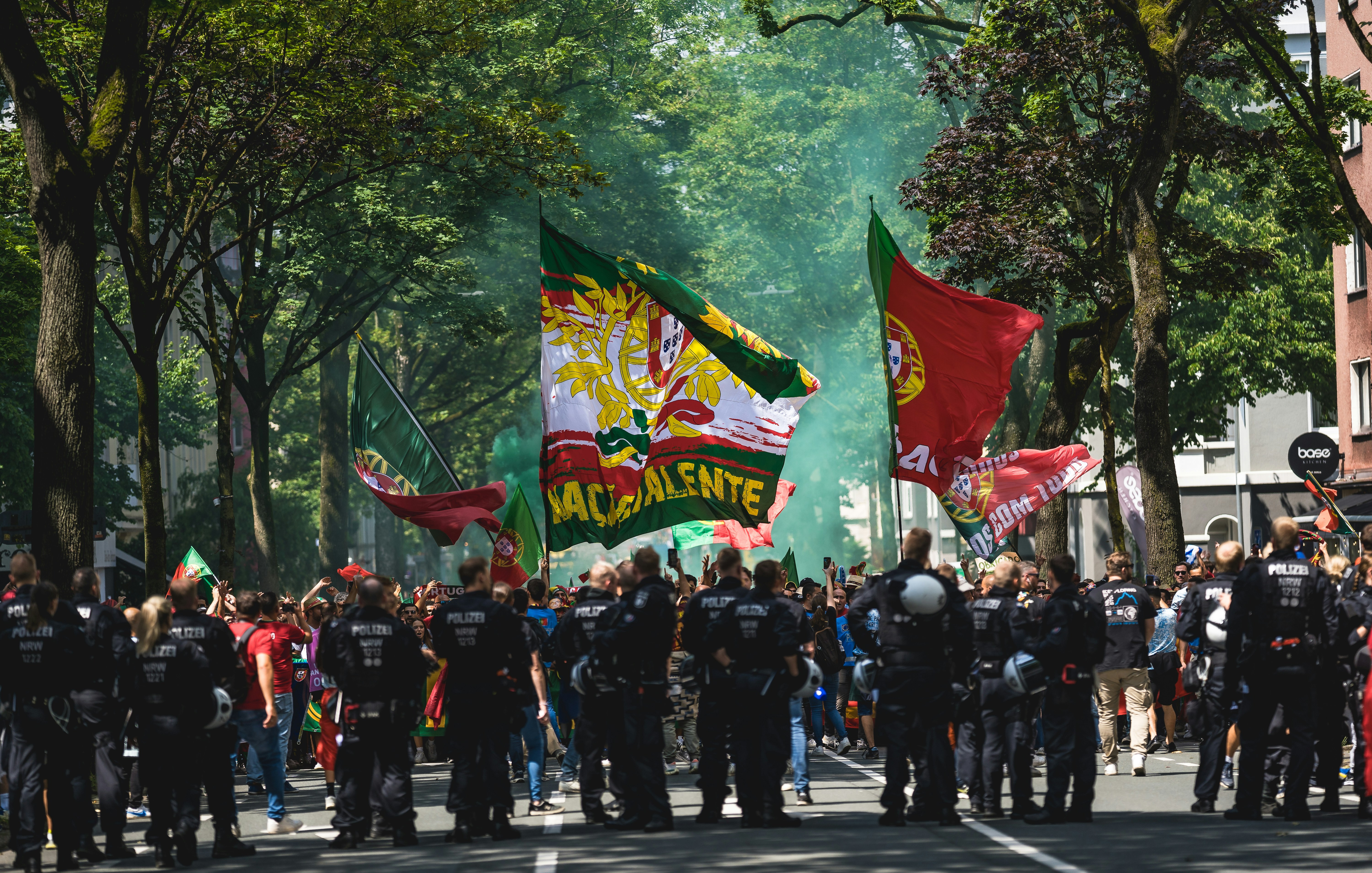 Marching Colors: Flags and Smoke Shield a City Square