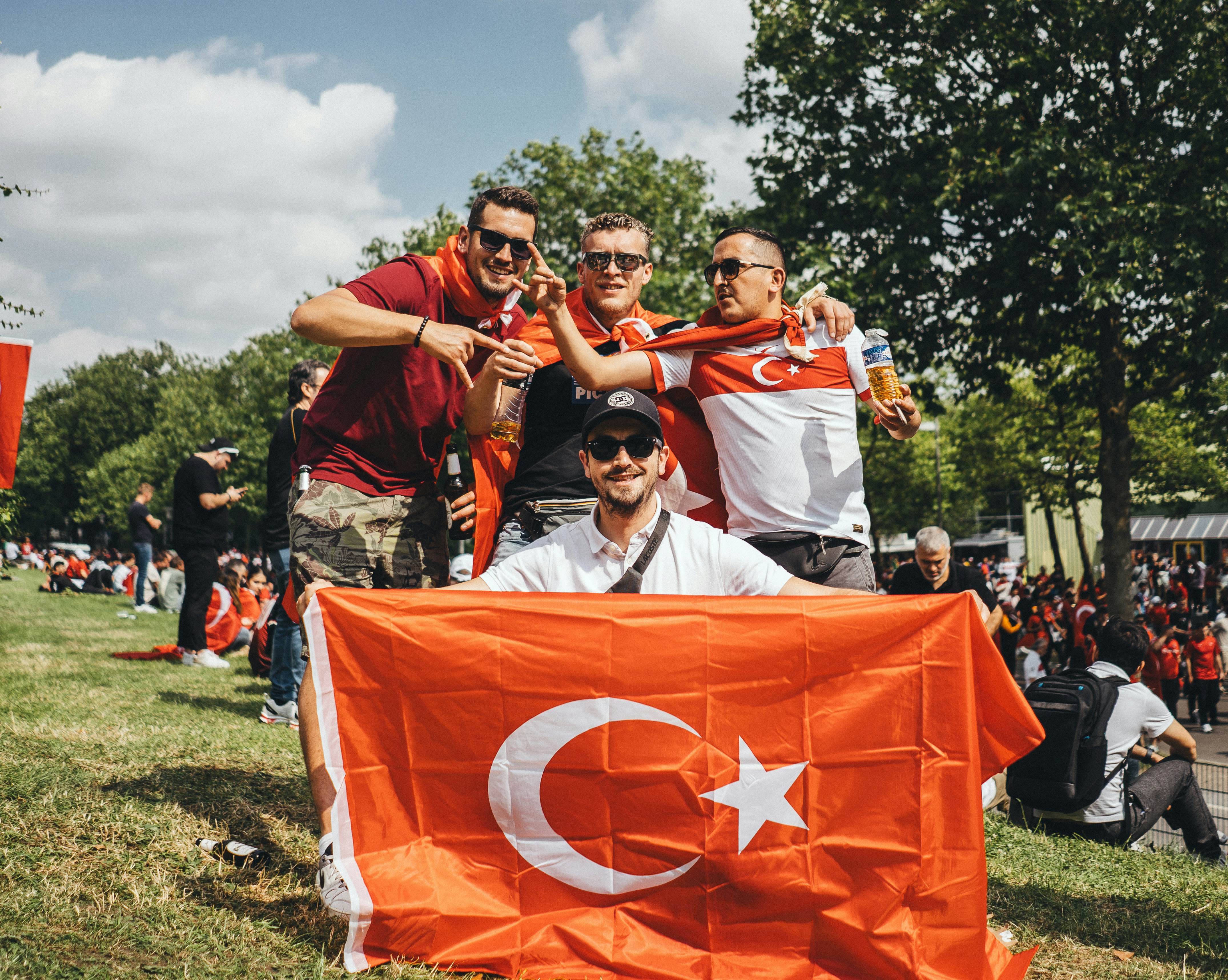 Turkish Flag Bearers: A Shared Moment Under Open Sky