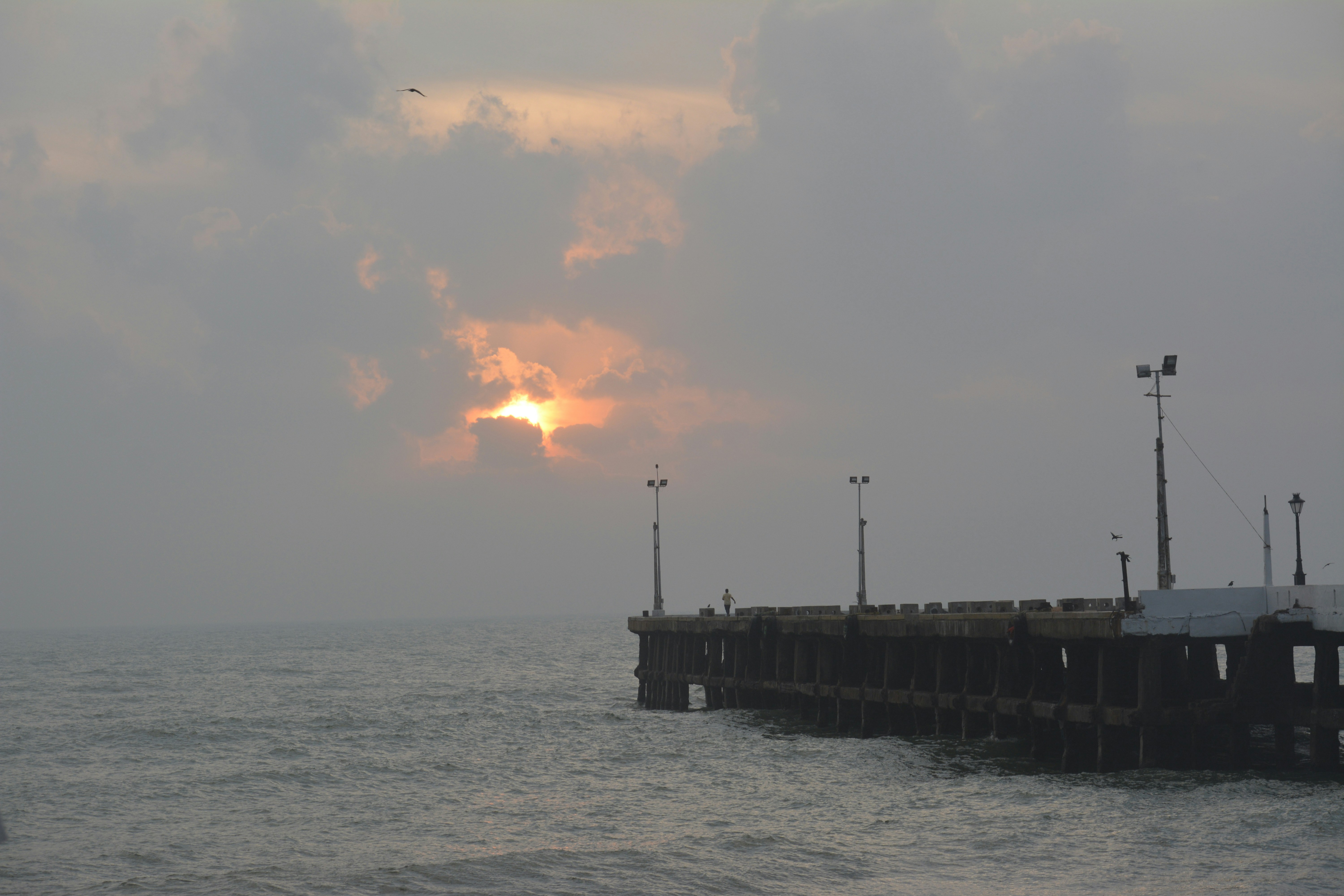 Sunset Silhouette Over a Quiet Pier