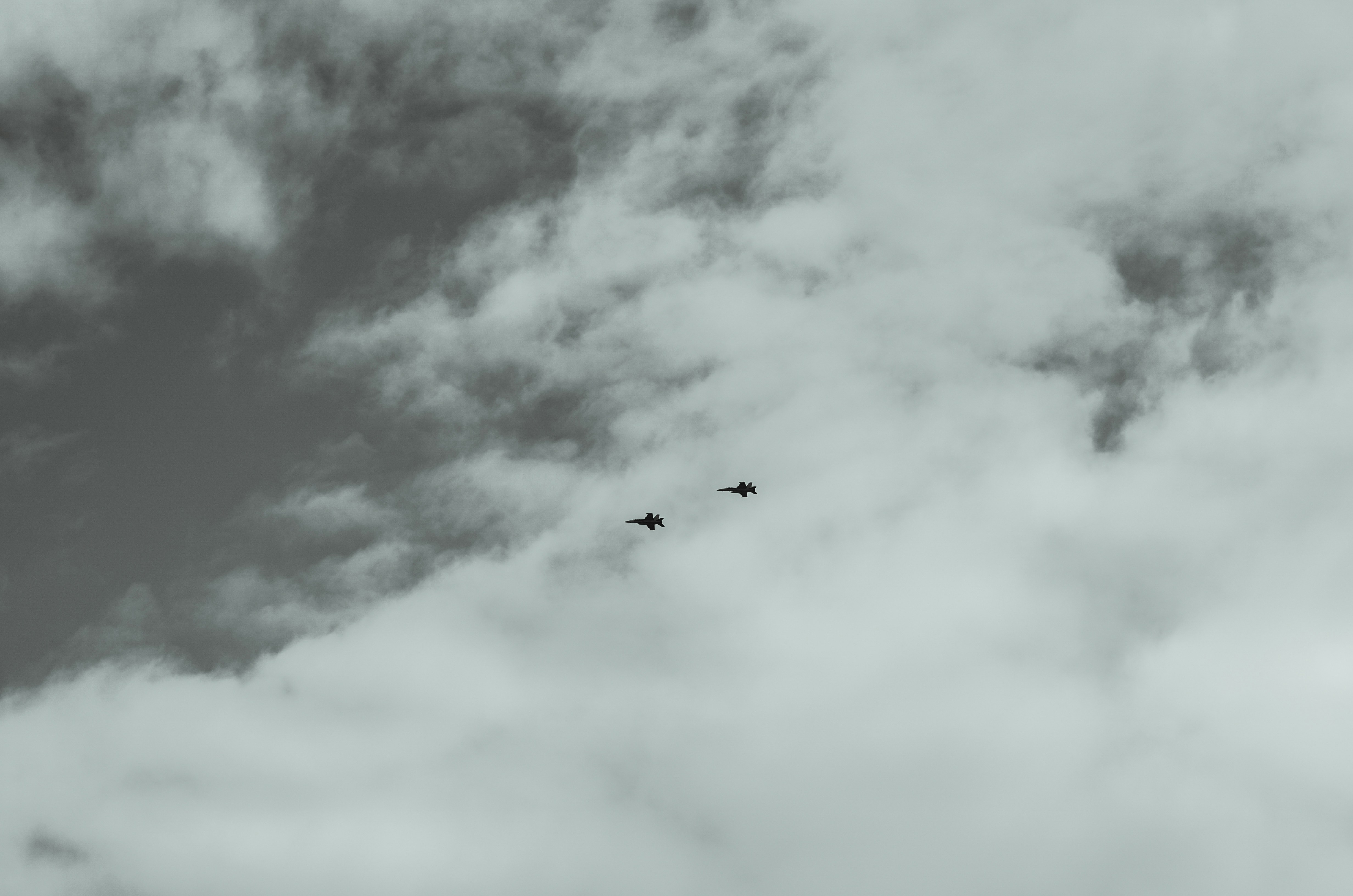 Triad in the Sky: A Quiet V formation in Monochrome