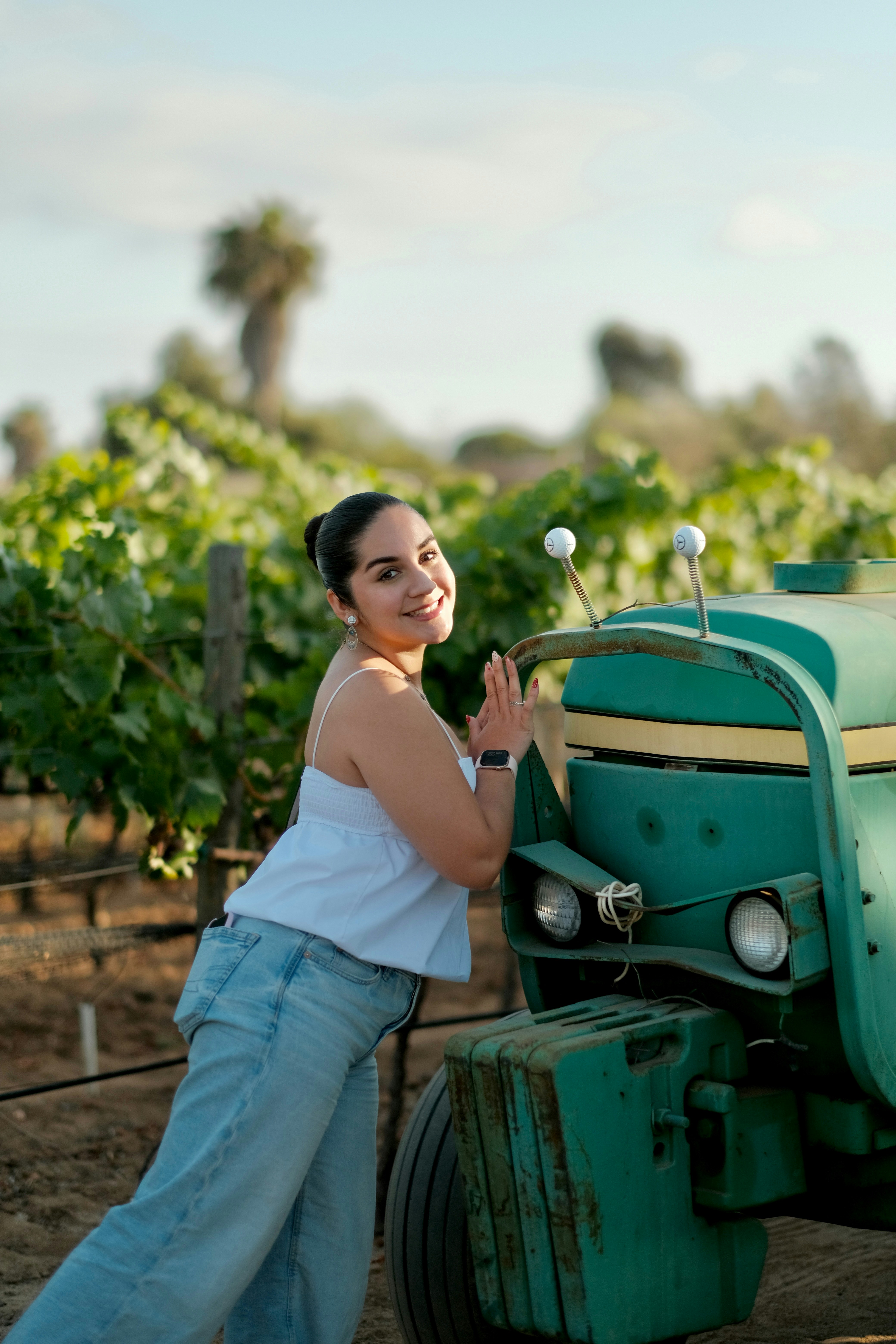 Portrait in a Vineyard with a Vintage Tractor