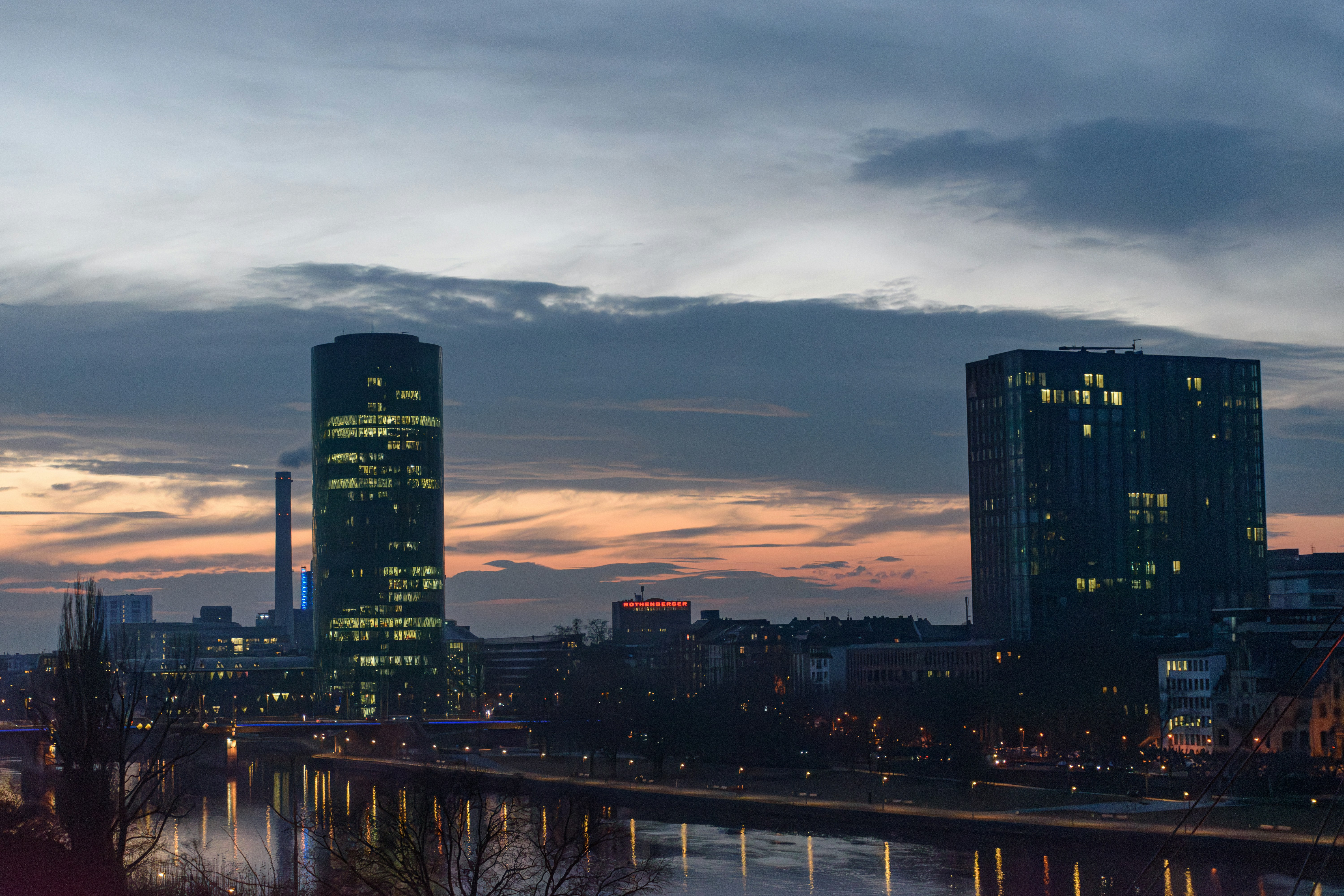 Dusk Riverside Towers: A Quiet City Wake