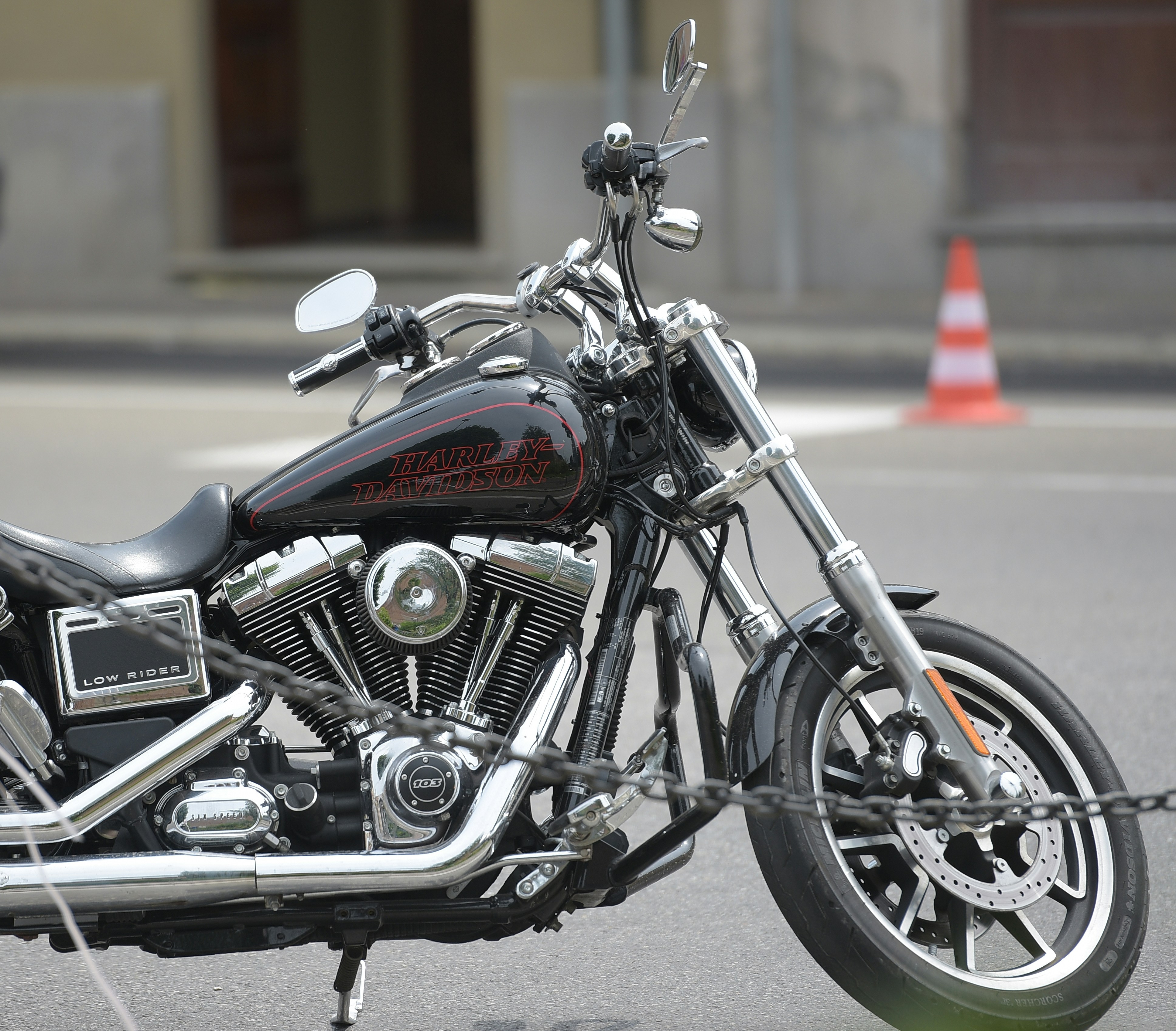 Chrome and Ink: A Harley-Davidson Stands Guard by the City Edge