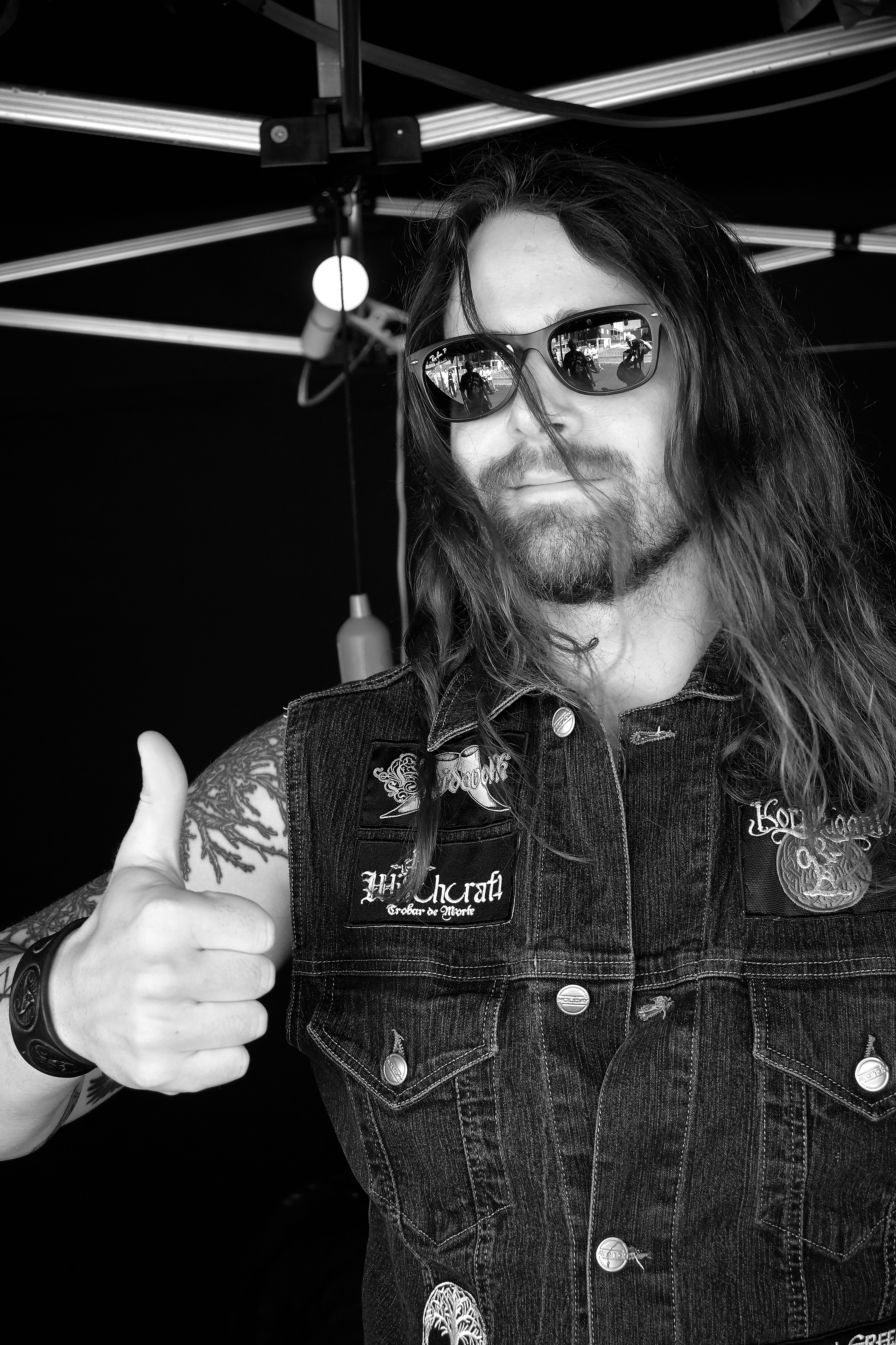 Thumbs Up in Black and White: A Rock Portrait in Denim