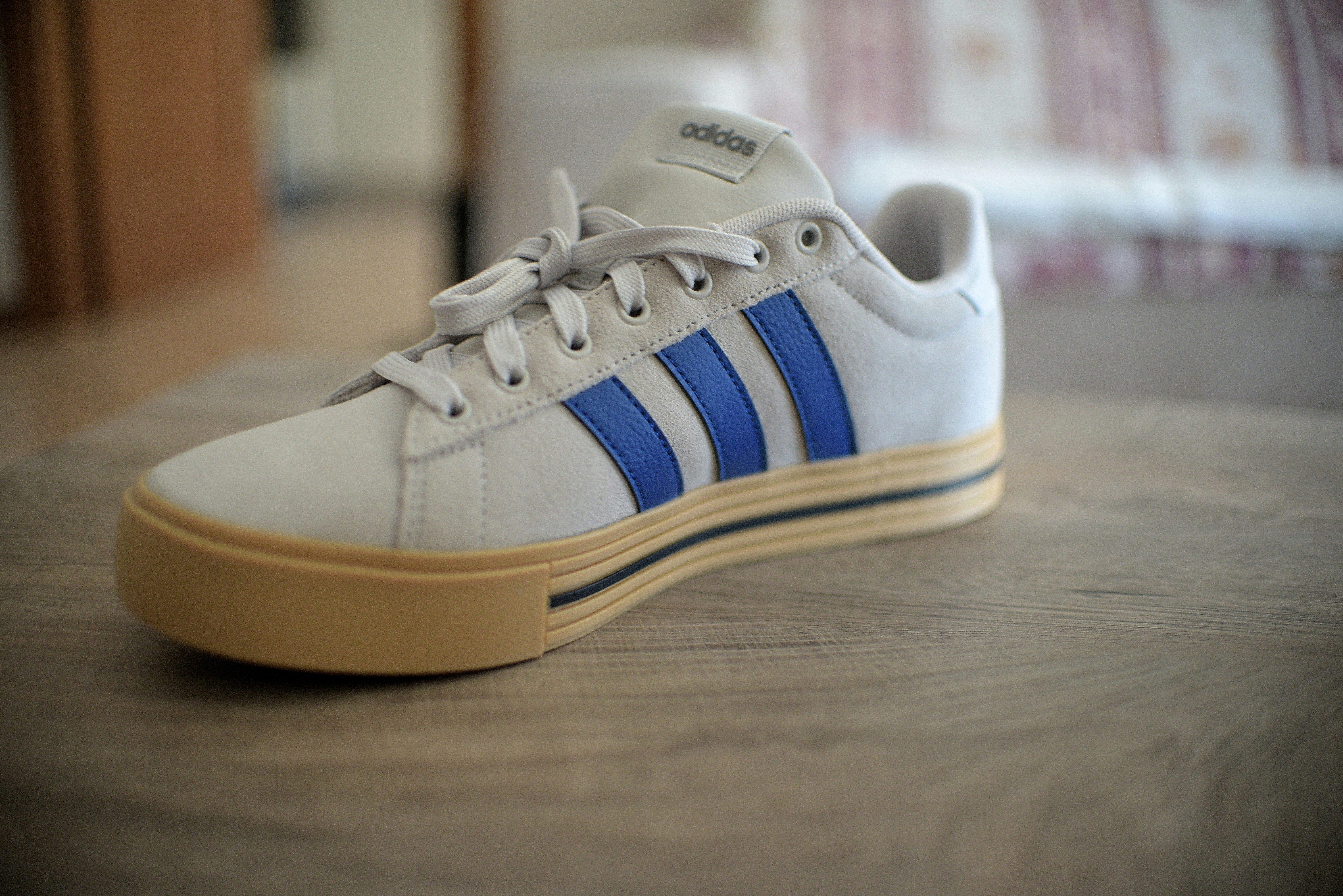 Sneaker on a Desk: Cream and Royal Stripes in Focus