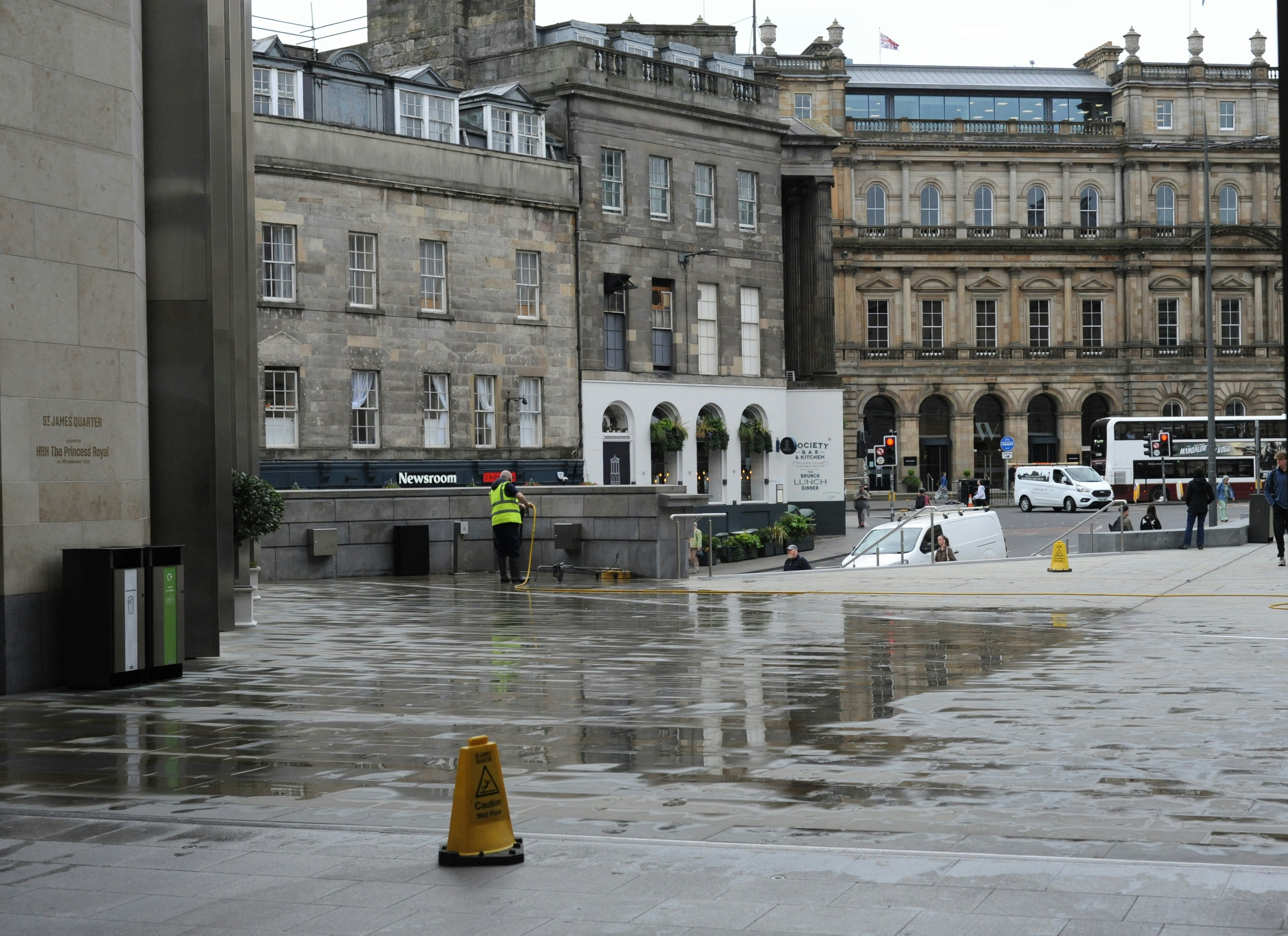 A Quiet Moment in a Cobbled Square After Rain