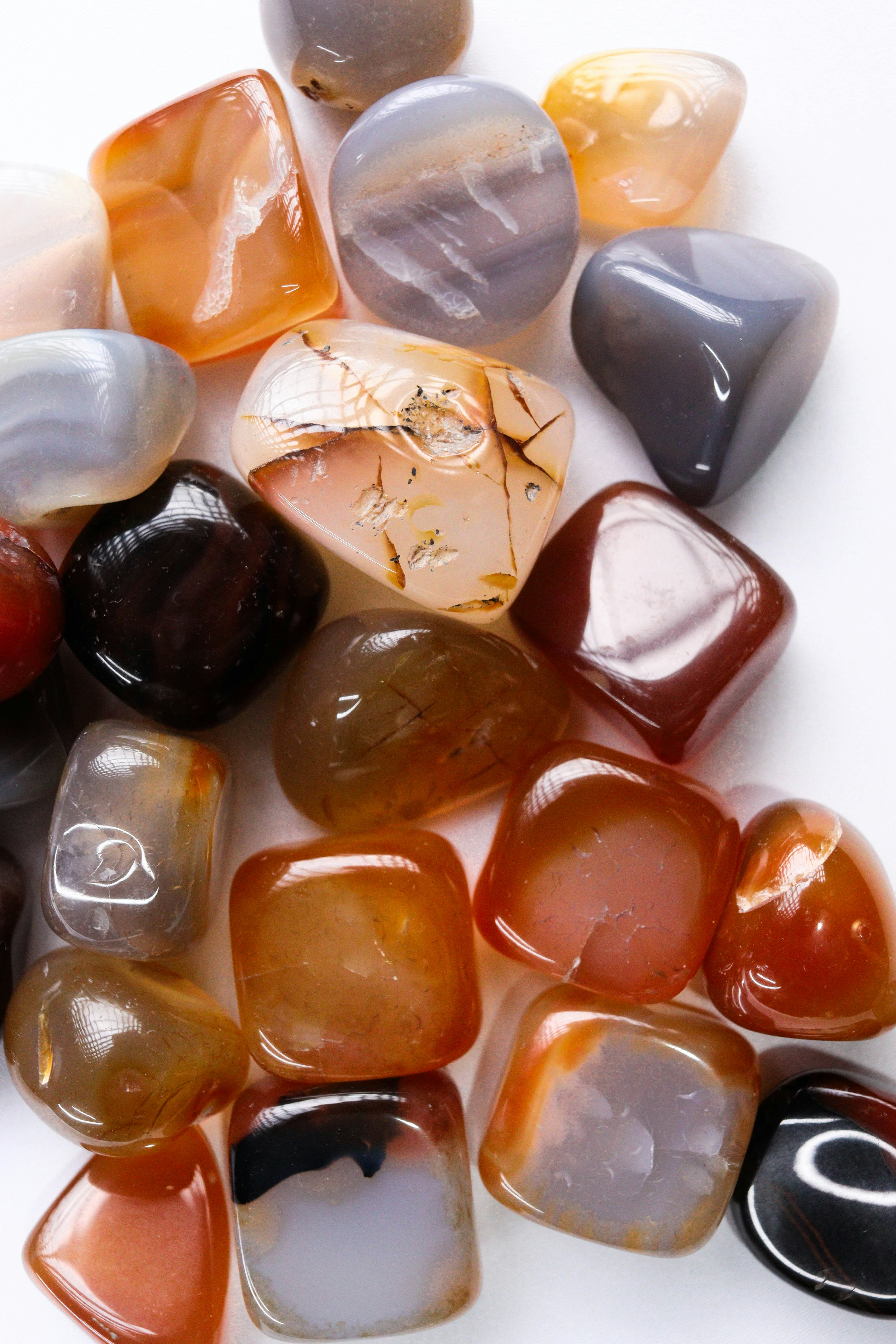 Gemstones of Evening Light: Polished Pebbles in Warm Hues
