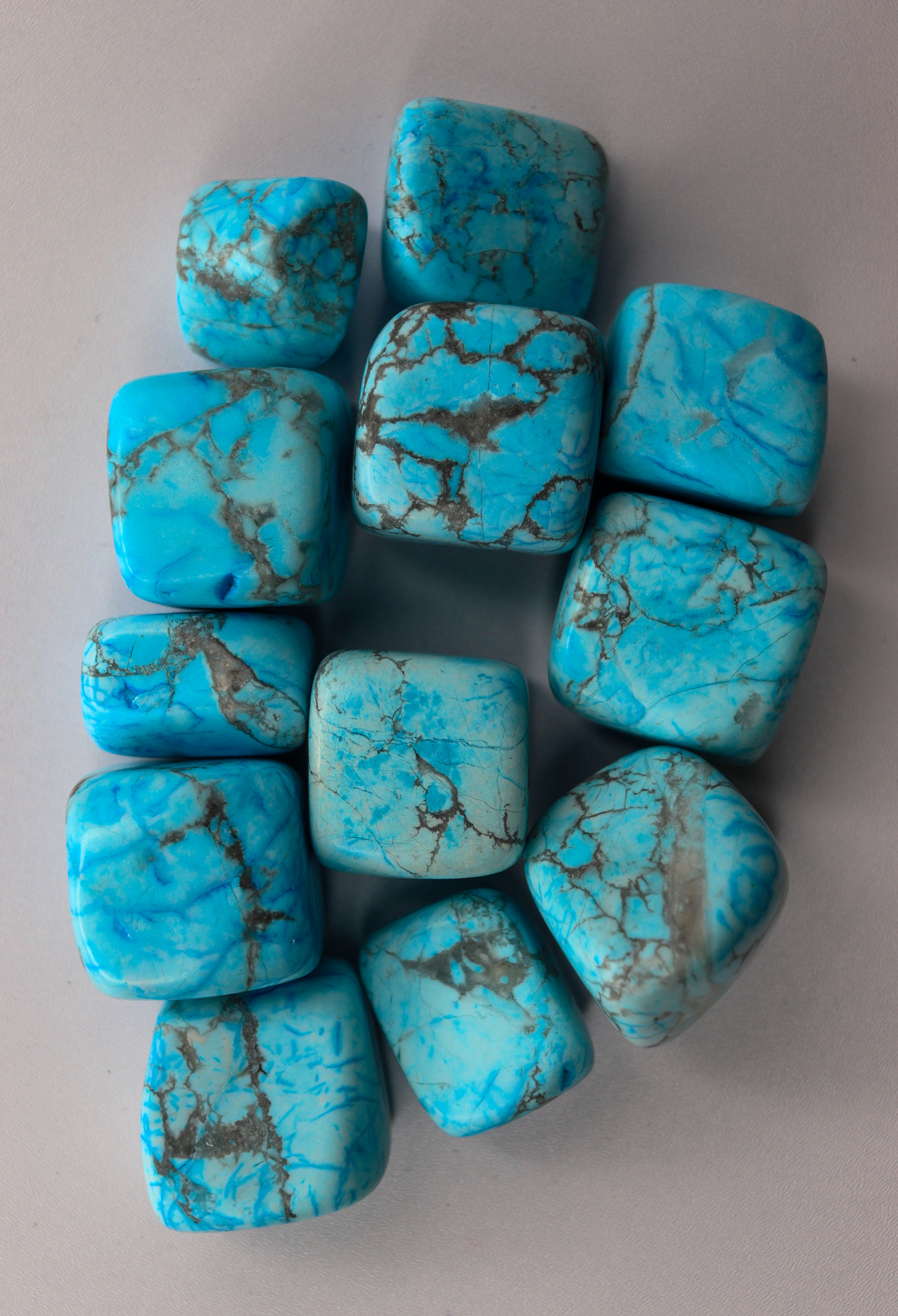 Azure Mosaic: Turquoise Pebbles with Vein-Flecked Patterns
