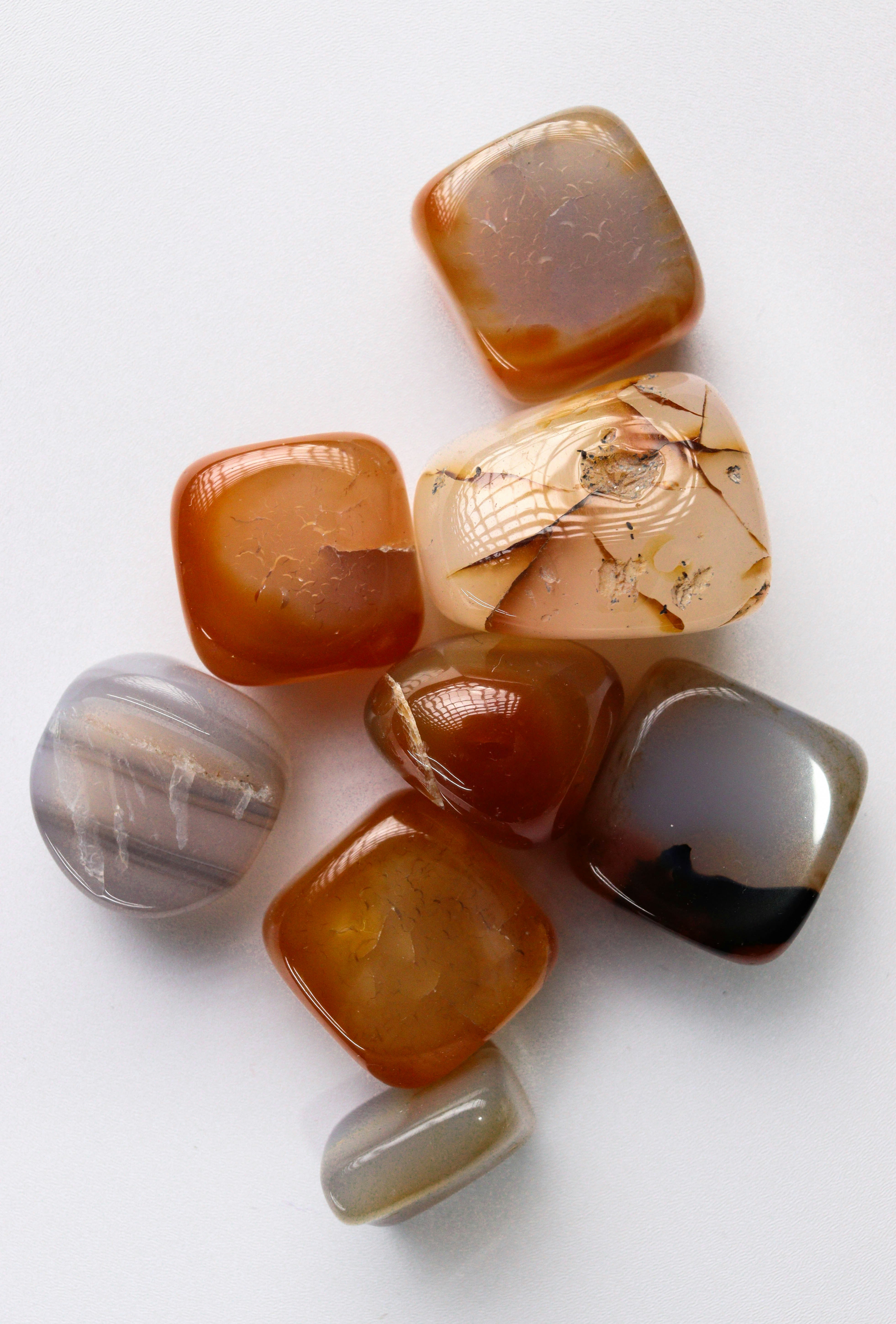Polished Gem Mosaic: Warm Amber Pebbles on White
