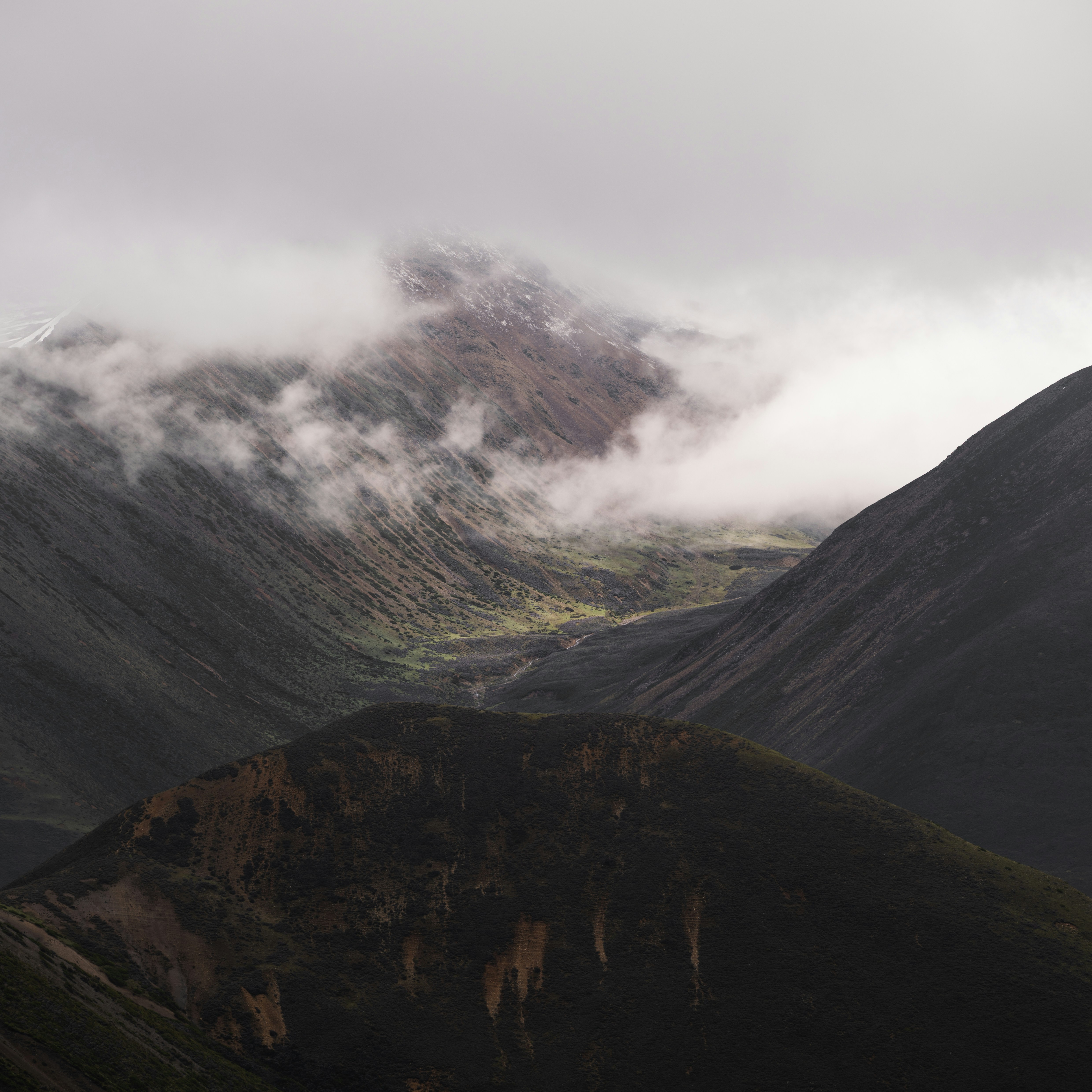 Valley Echoes: Mist Rolls Over the Ridge