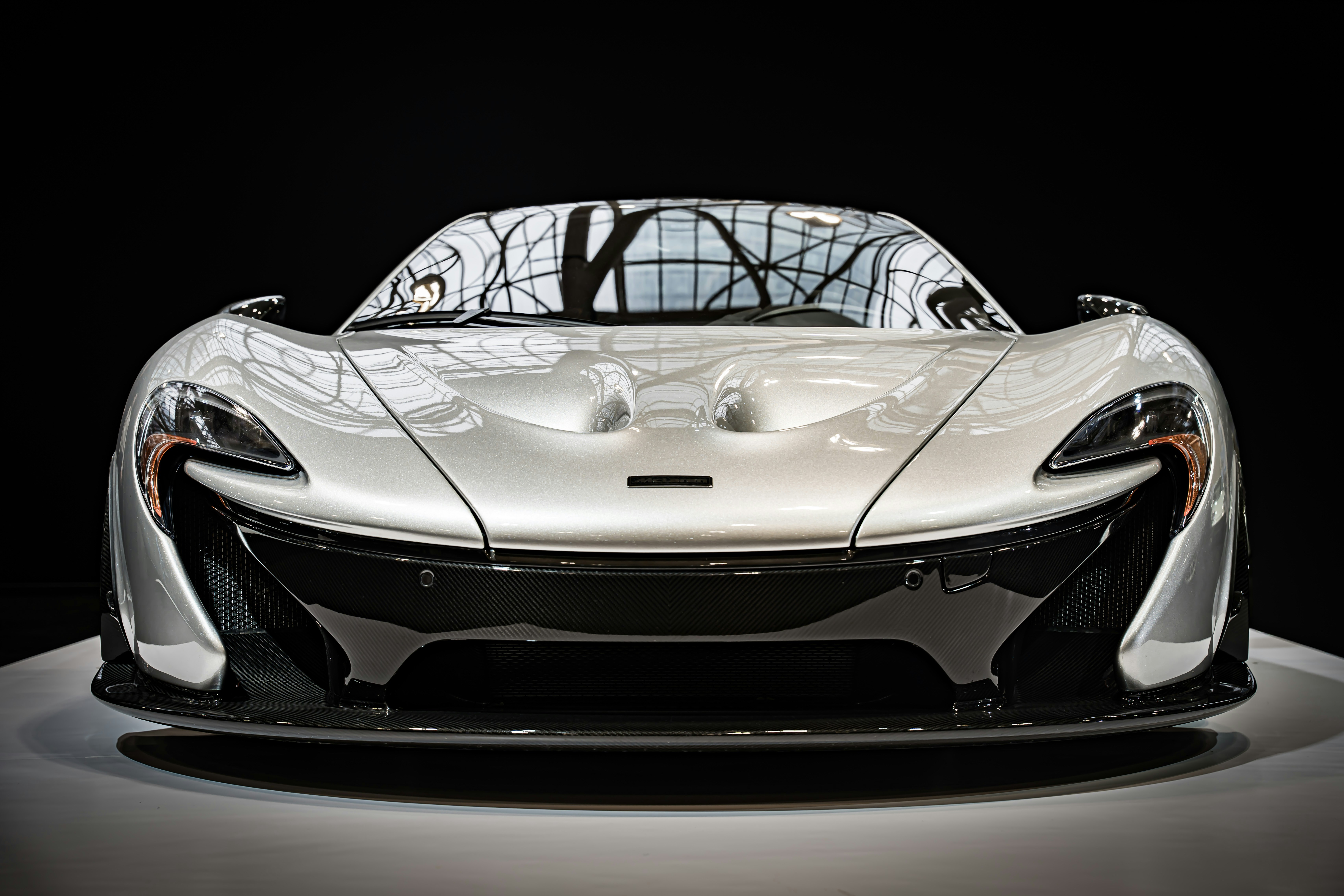 Chrome Cloak: A Sleek Hypercar Emerges from Studio Shadows