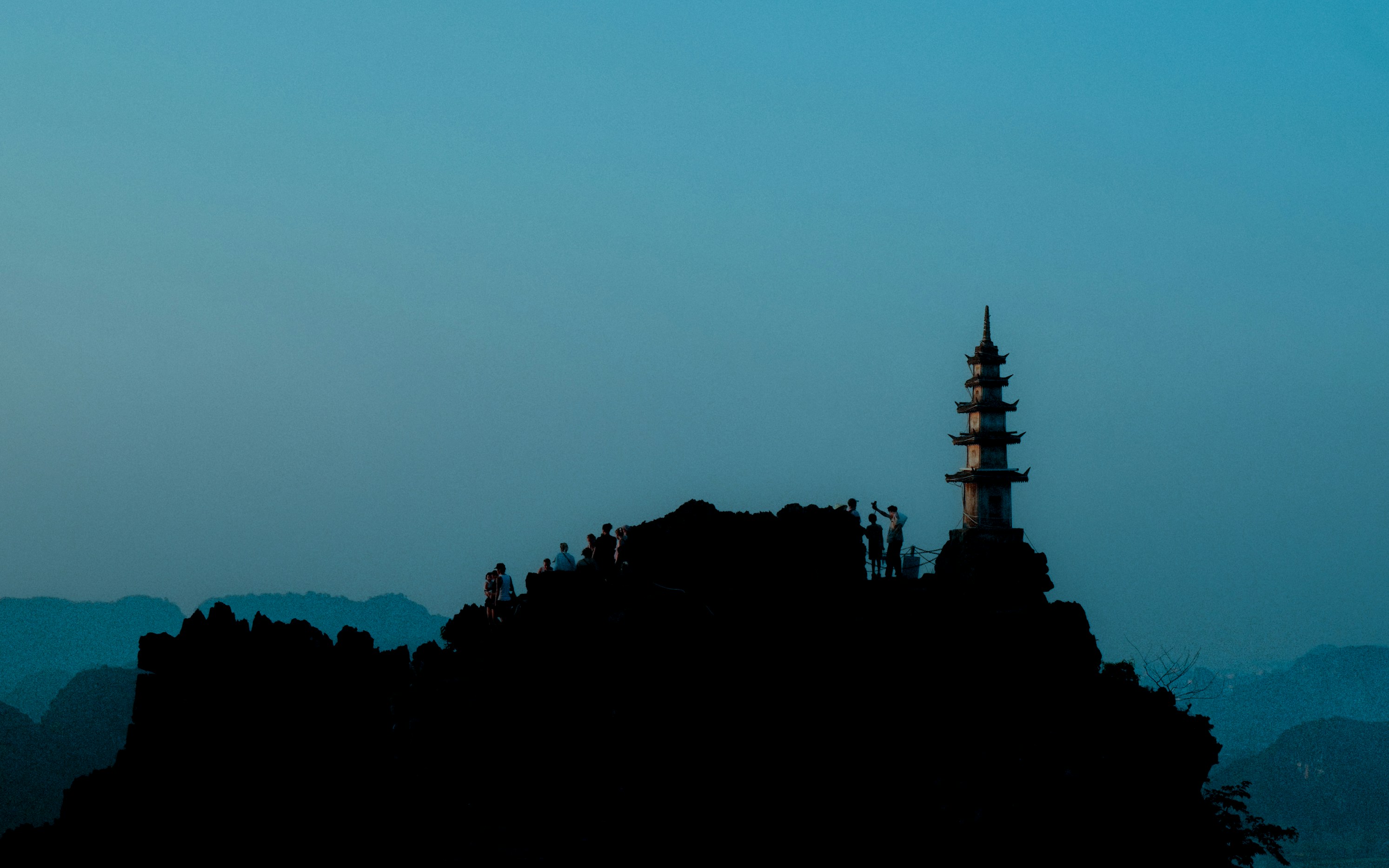 Silhouette of a Clifftop Pagoda at Dusk
