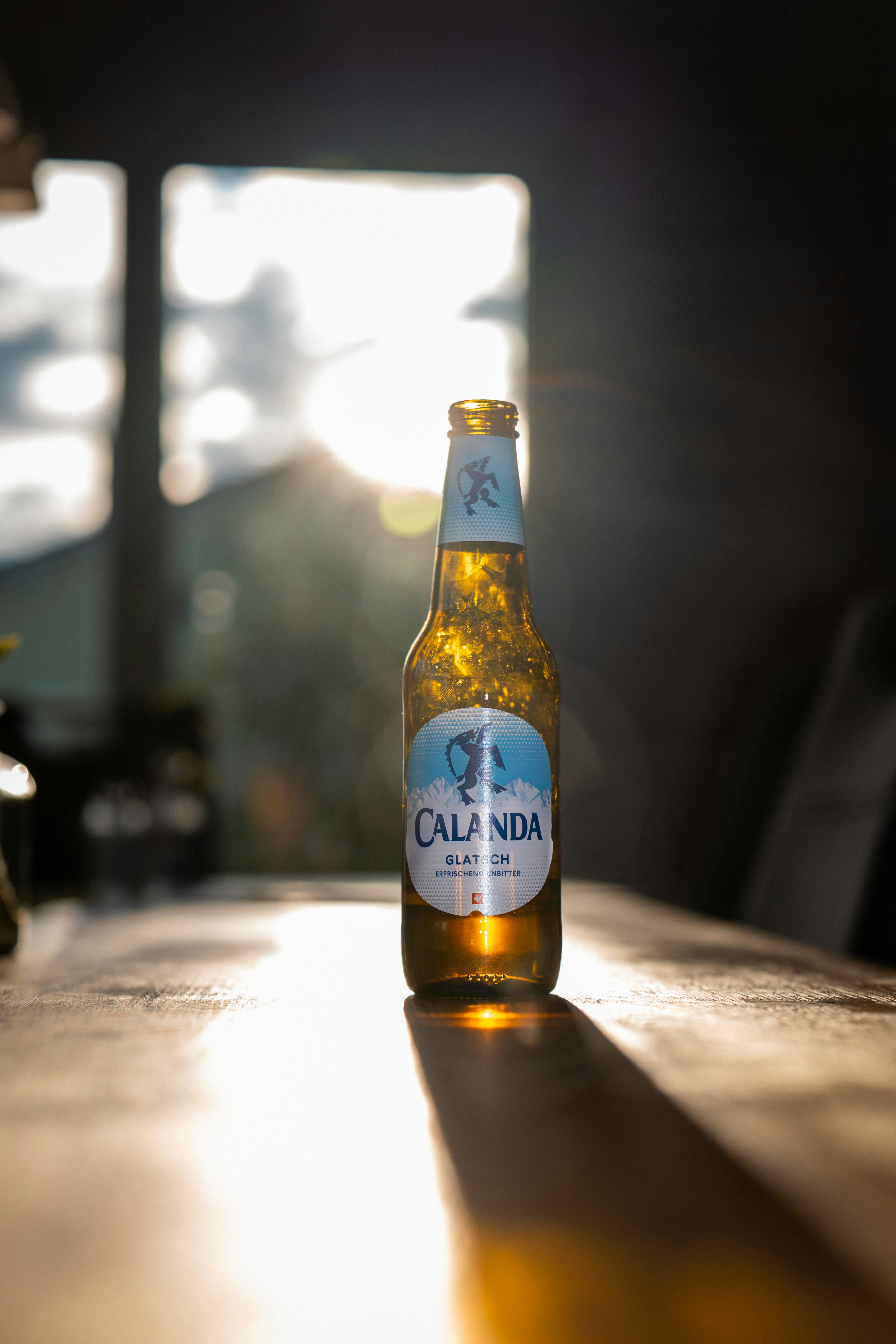 Calanda on Glassy Light: A Bottled Moment in Late Sun