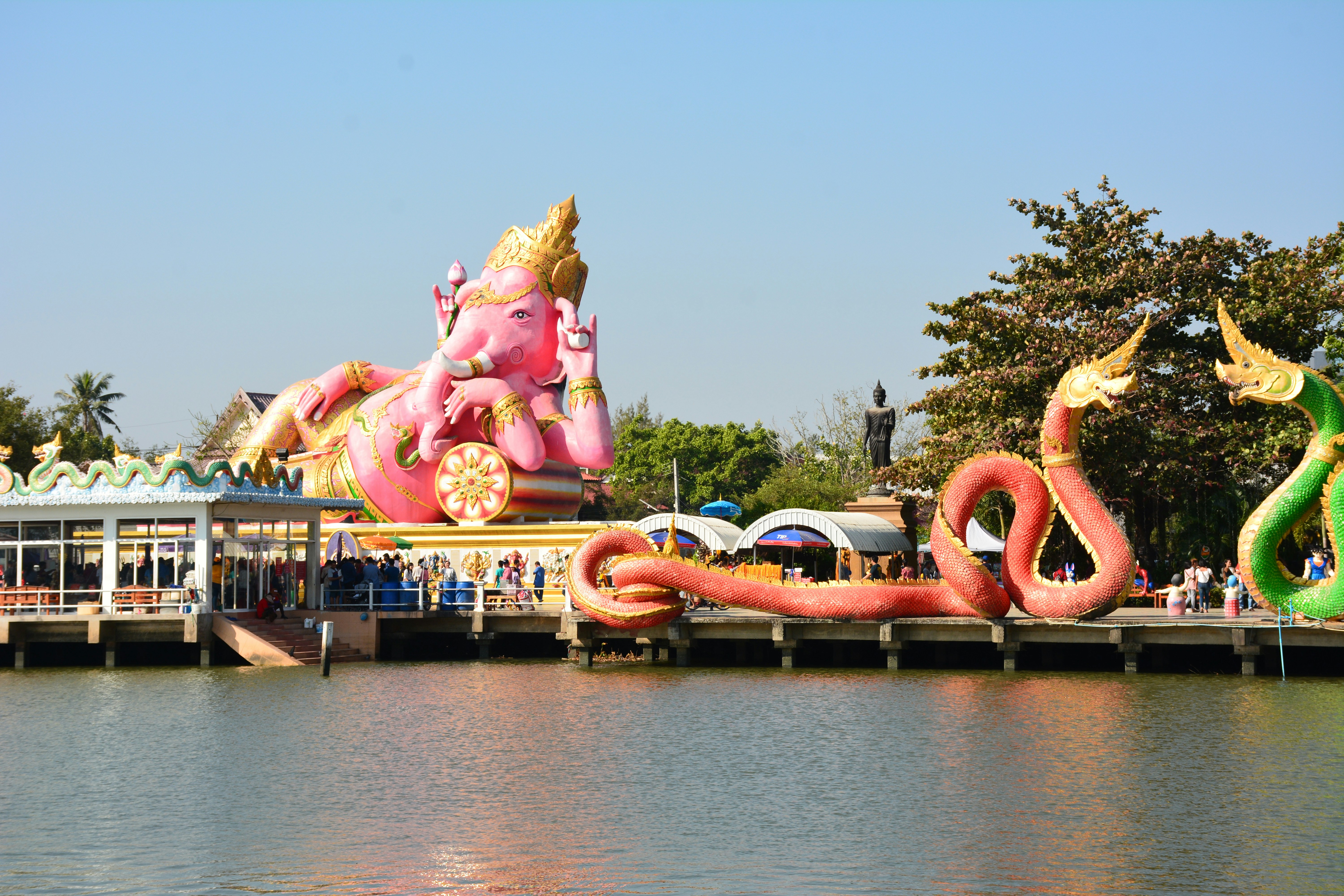Pink Ganesh over the Canal: Velvet Reptile and Dragon Parade at Dusk