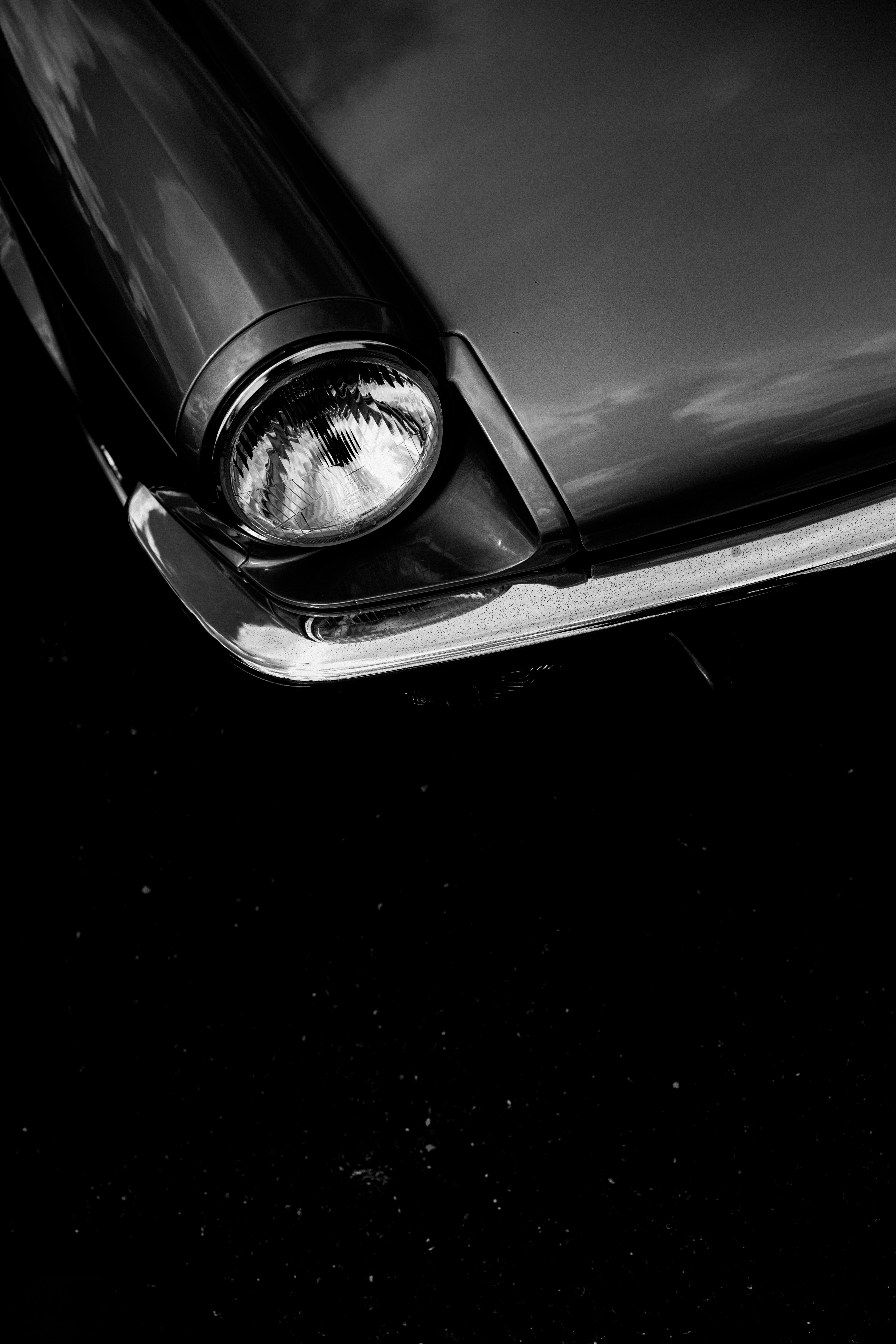 Chrome and Shadow: A Classic Car Hood in Mono