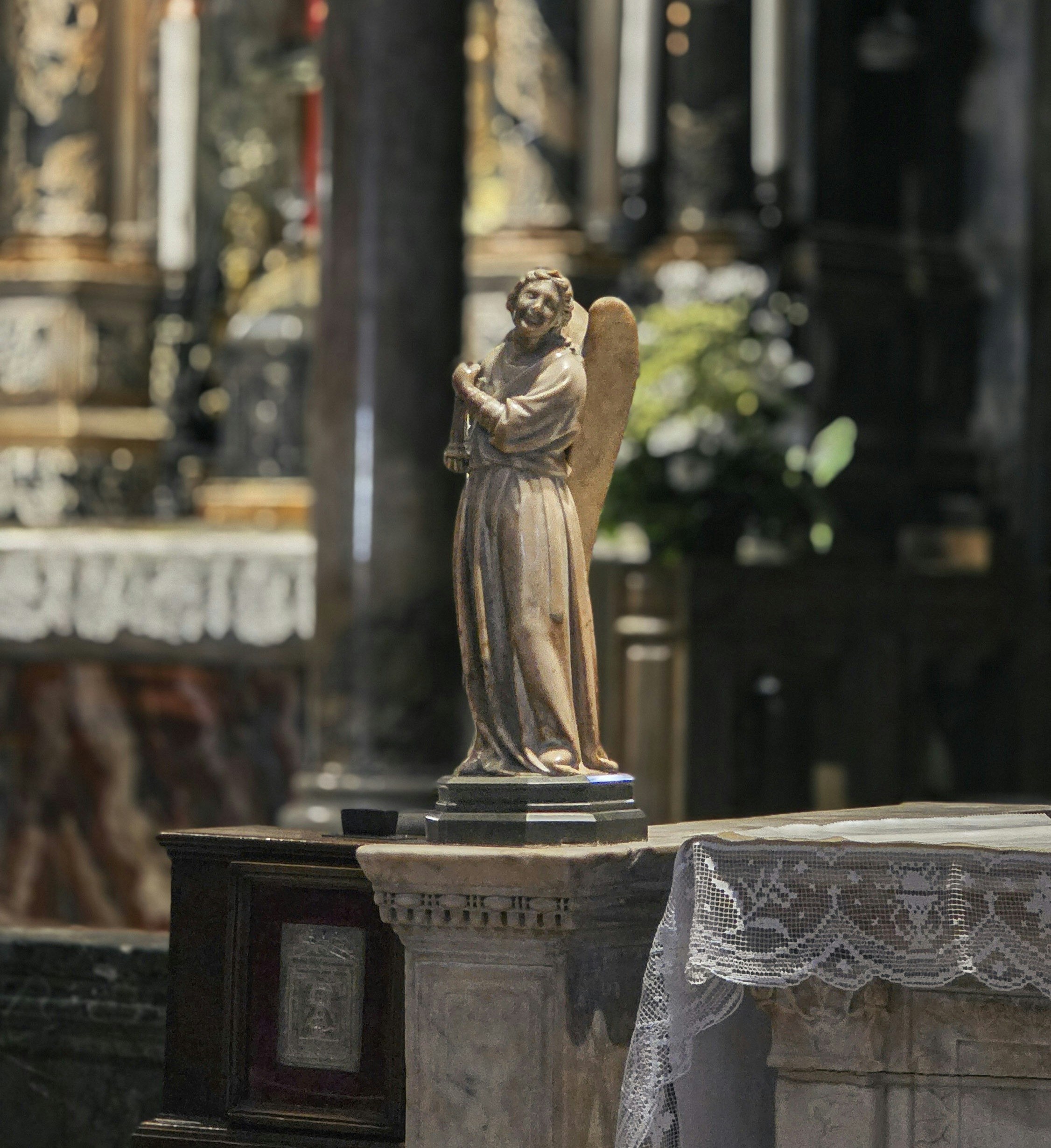 Angel with Wings: A Quiet Statue Guarding the Altar