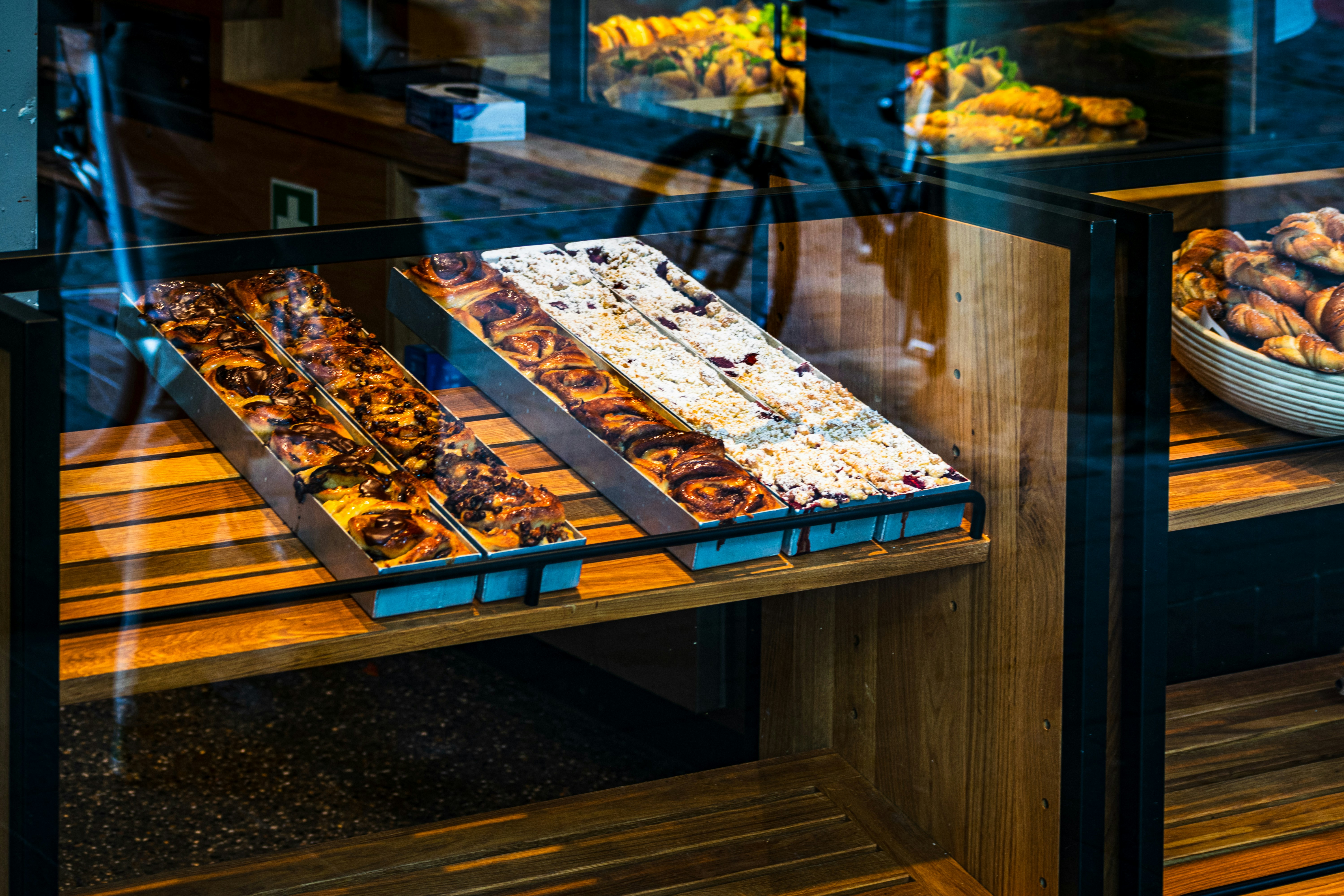 Golden Pastry Display: Clean Lines and Crusty Detail in a Bakery Window