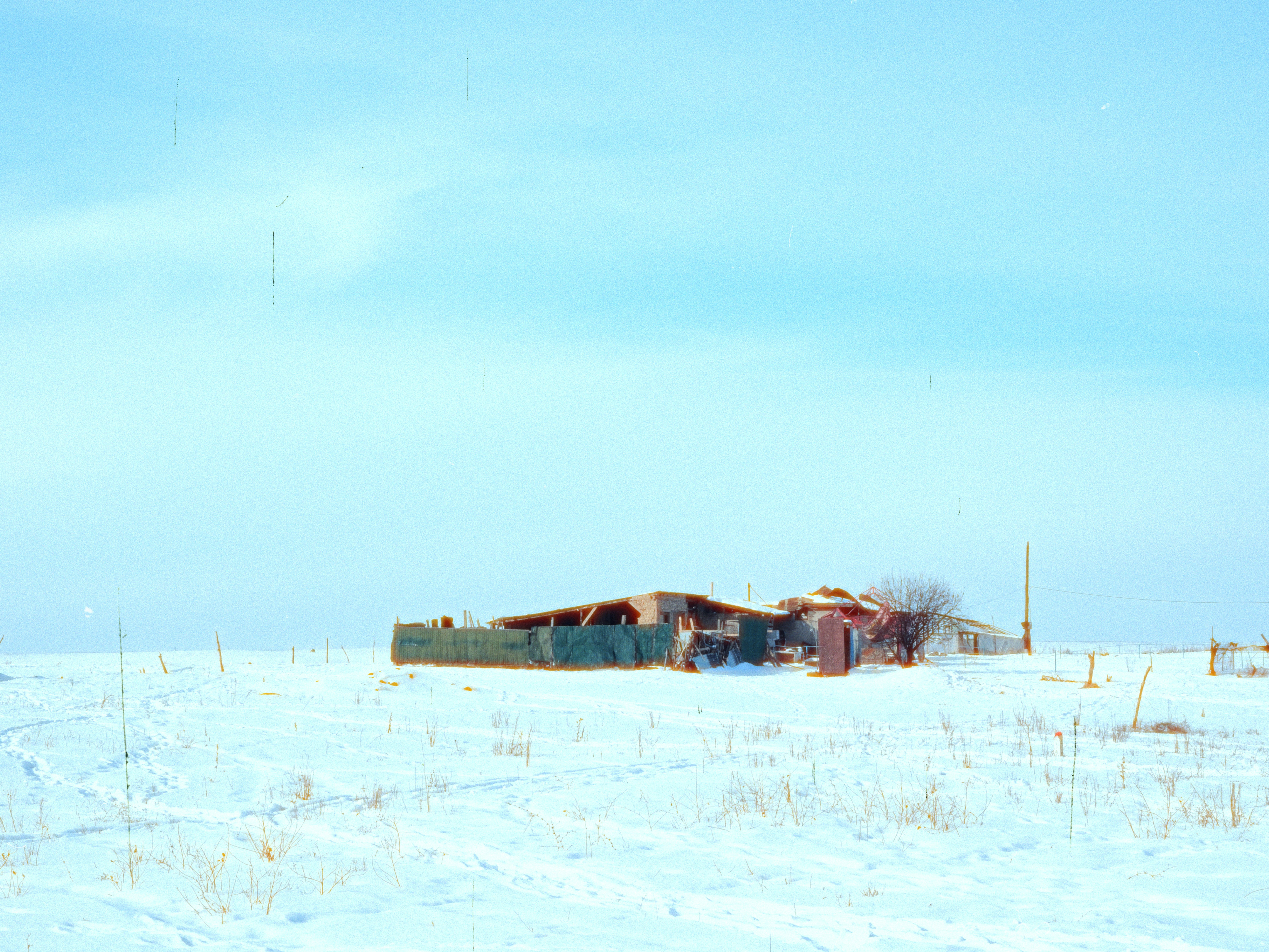 Deserted Snowbound Shed on a Quiet Prairie