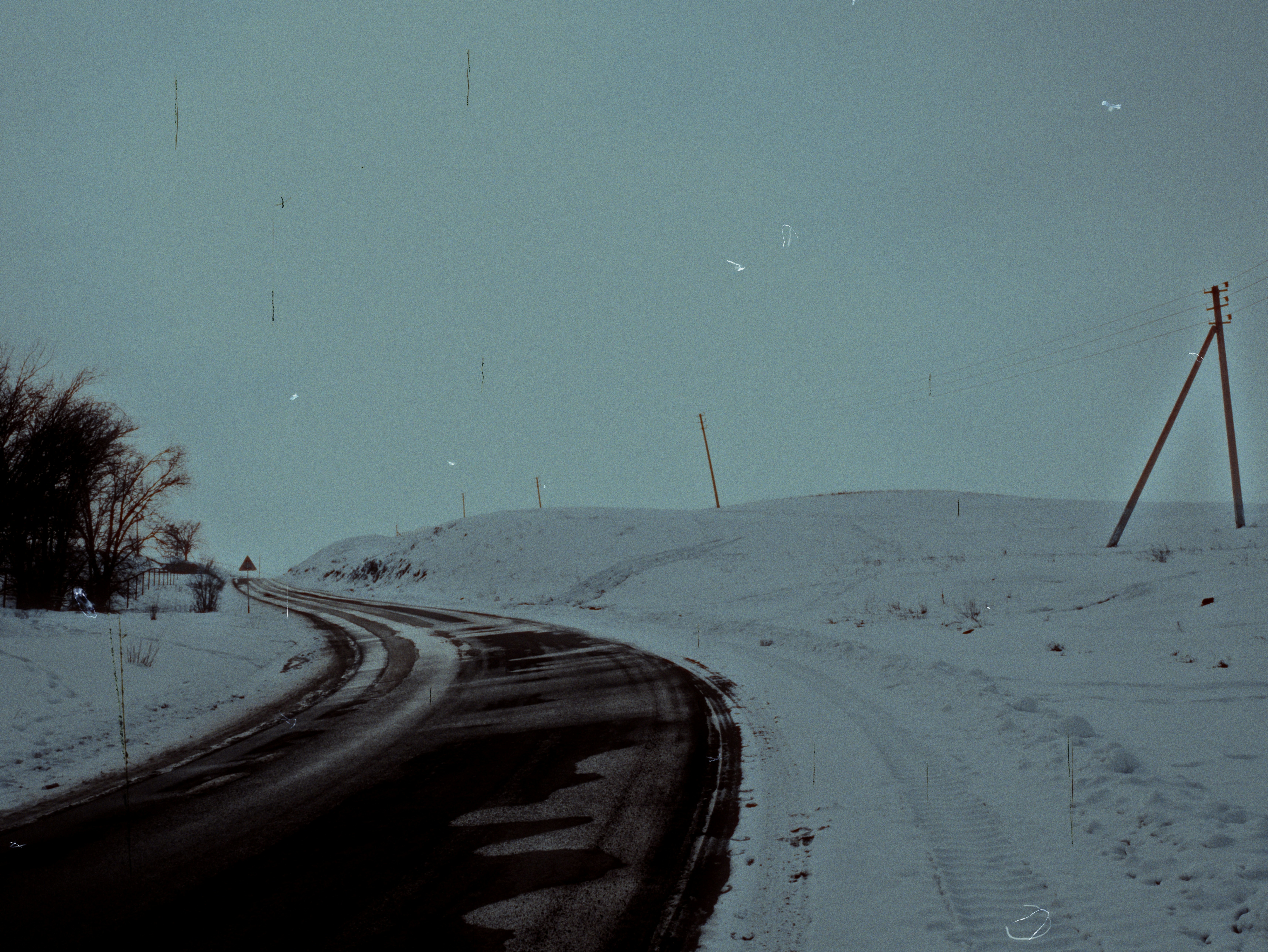 Snowbound Curve: A Quiet Road Winding Through the Frost