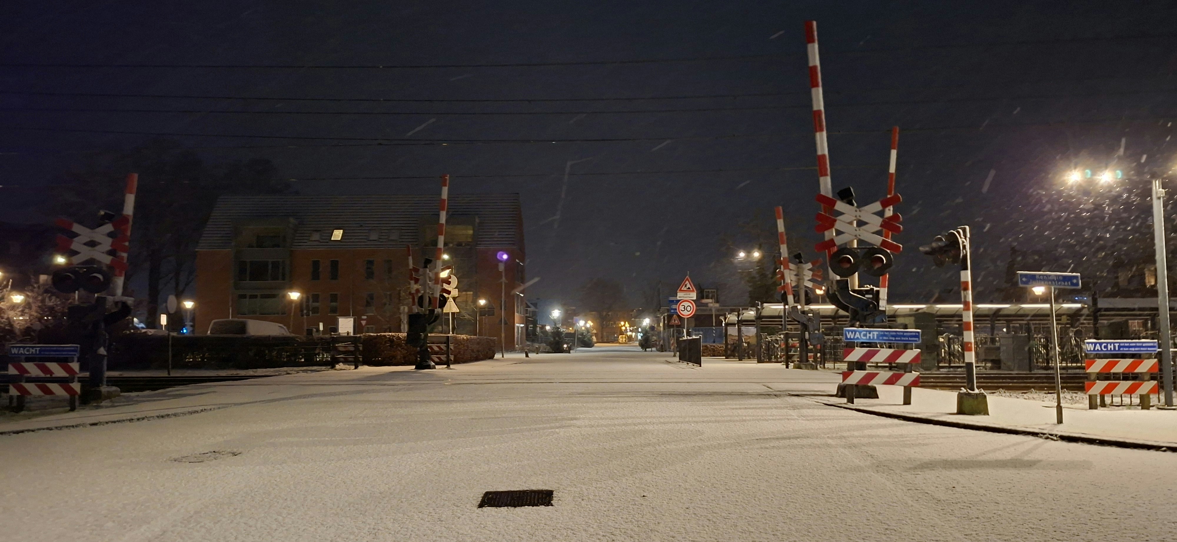 Snowbound Crossing: A Quiet Night at the Rails