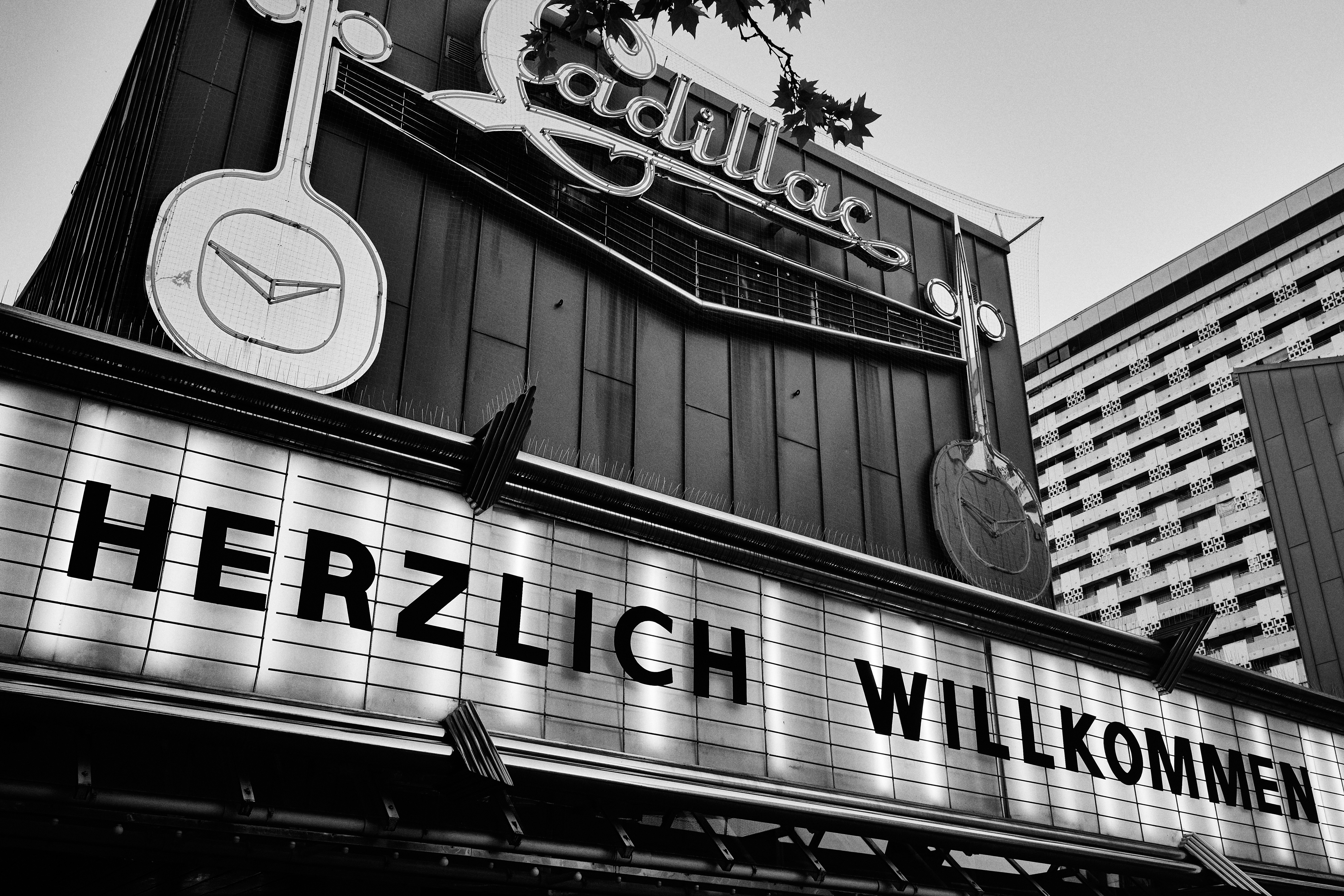 Neon Welcome: A Vintage Theater Facade in Bold Monochrome