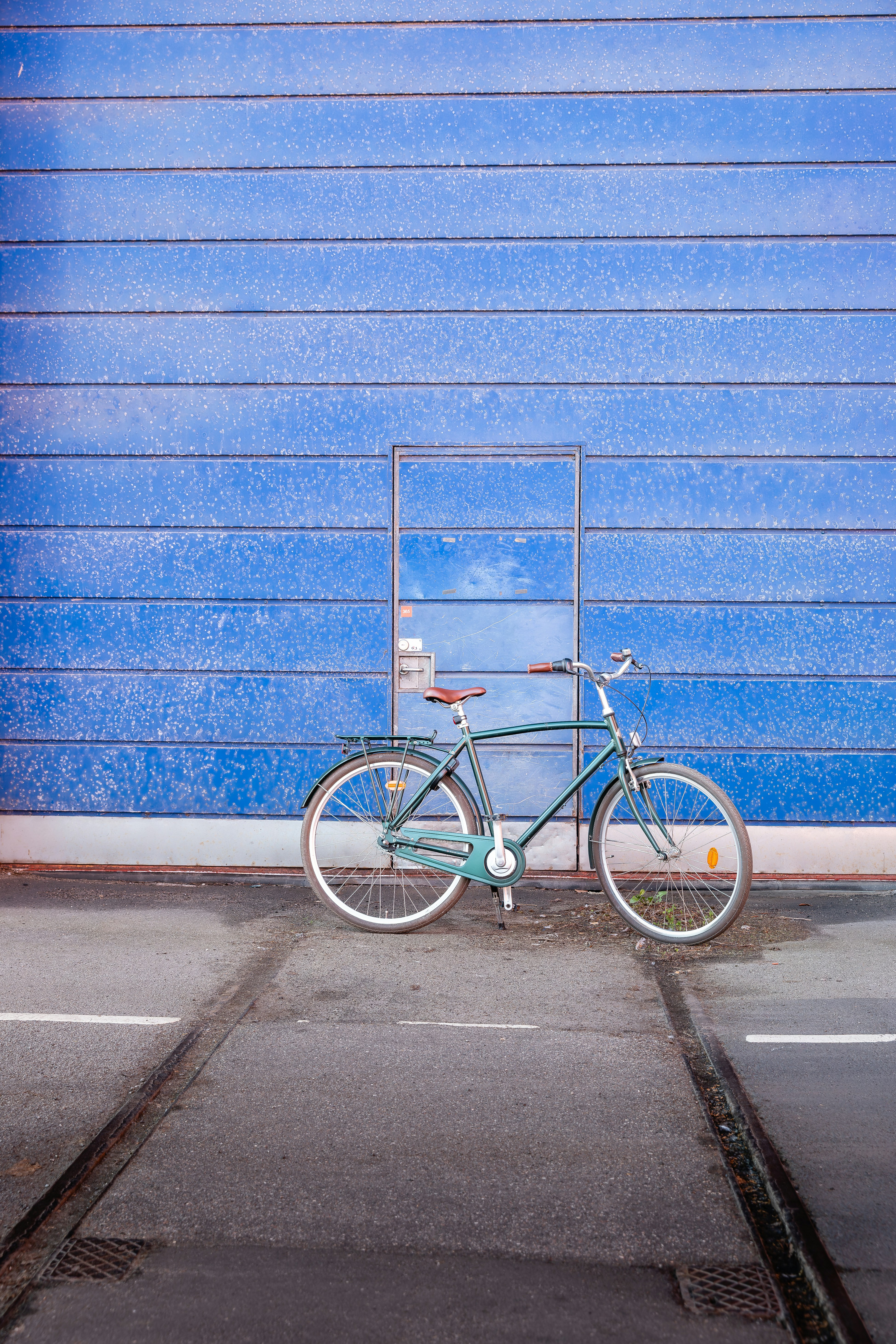 Blue Wall, Green Bicycle: Quiet Street Portrait