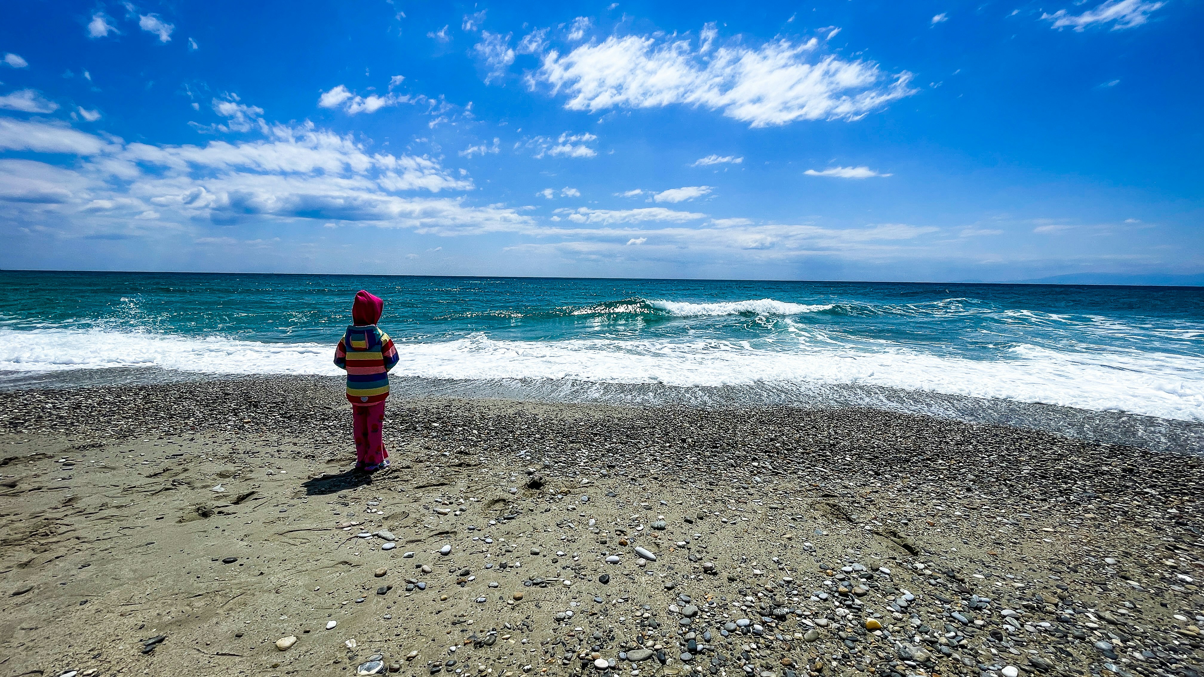 Child at the Waterline: A Quiet Beach Moment
