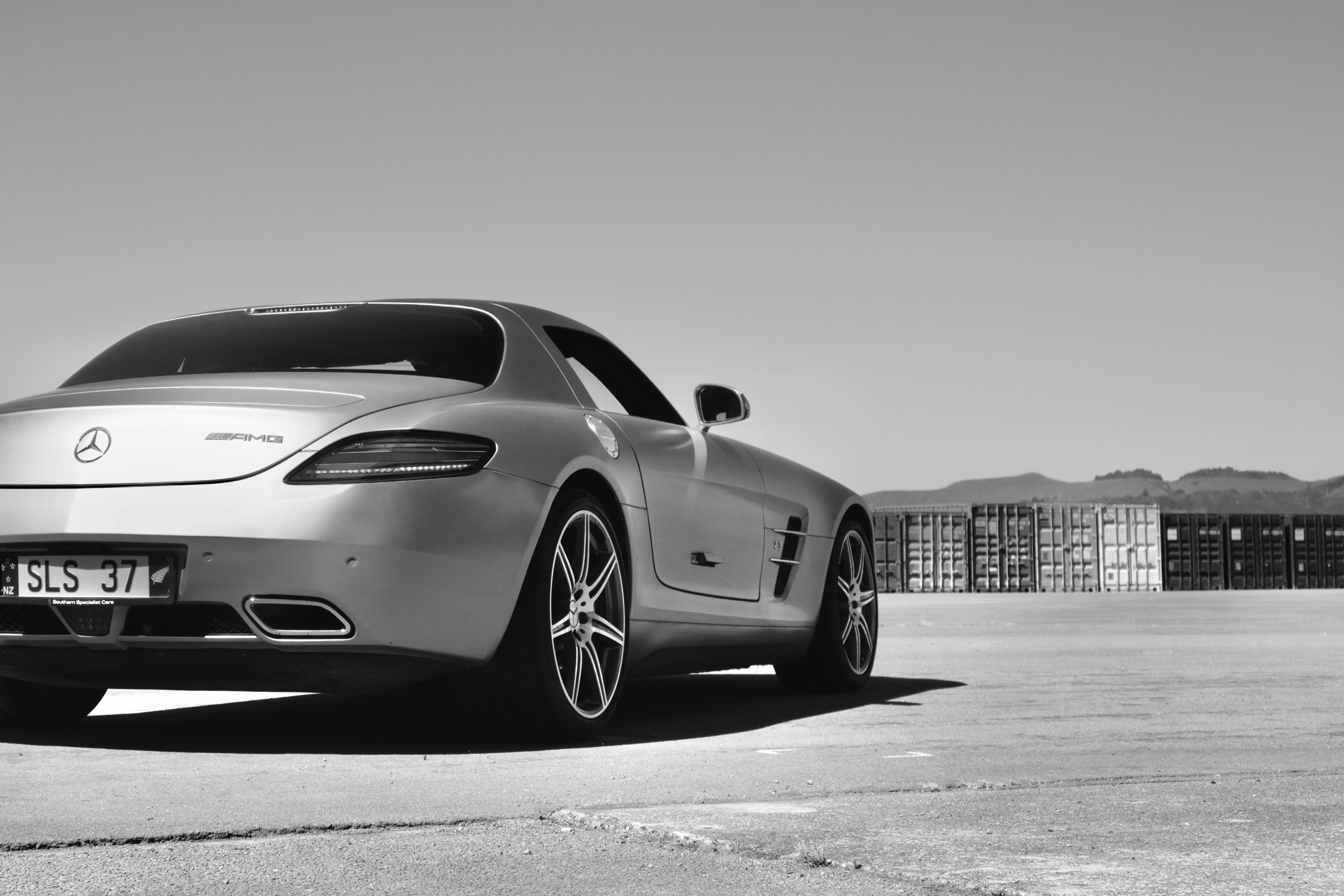 Sleek mercedes-benz sls amg sports car in black and white.