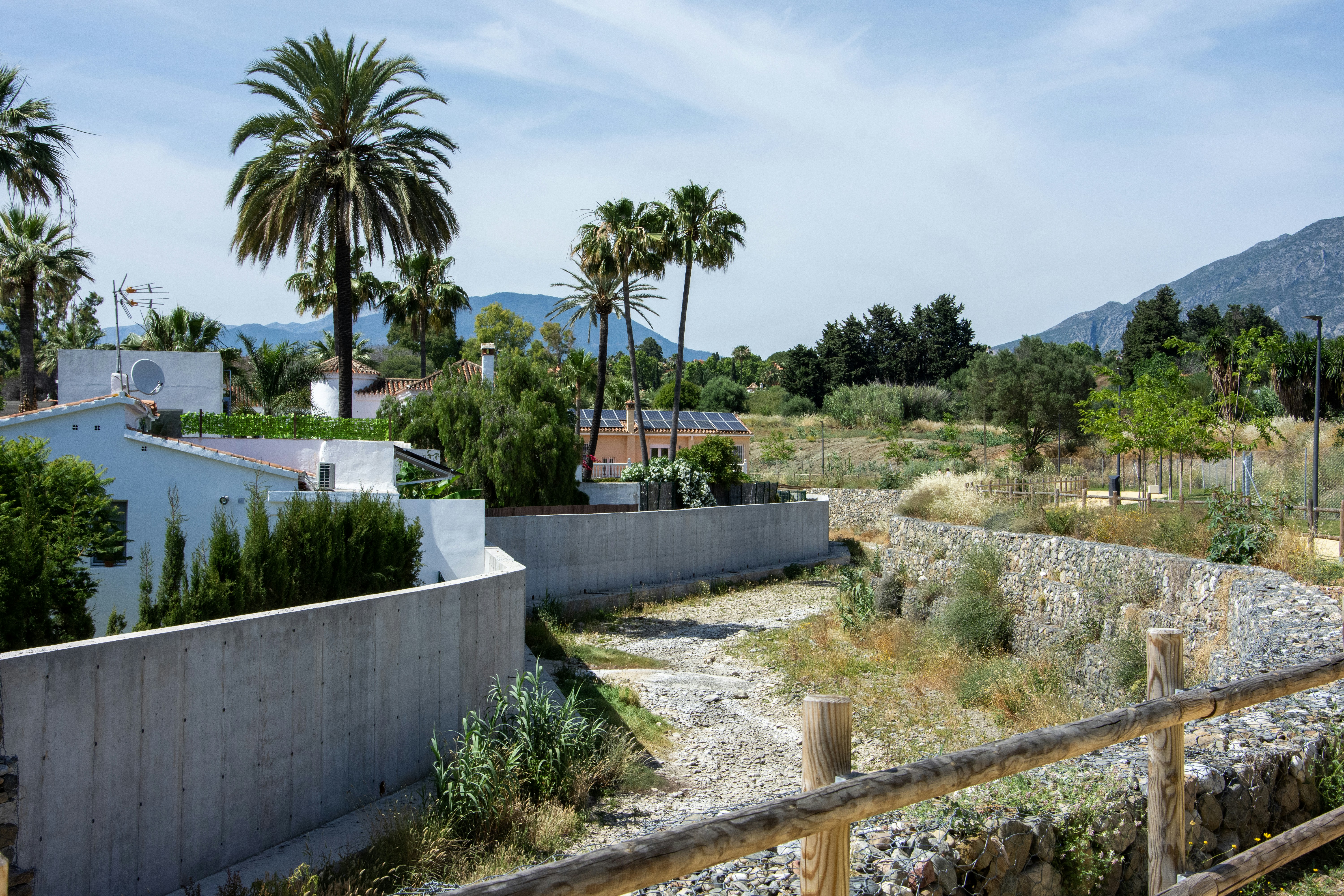 Sunlit Path Through a Mediterranean Courtyard