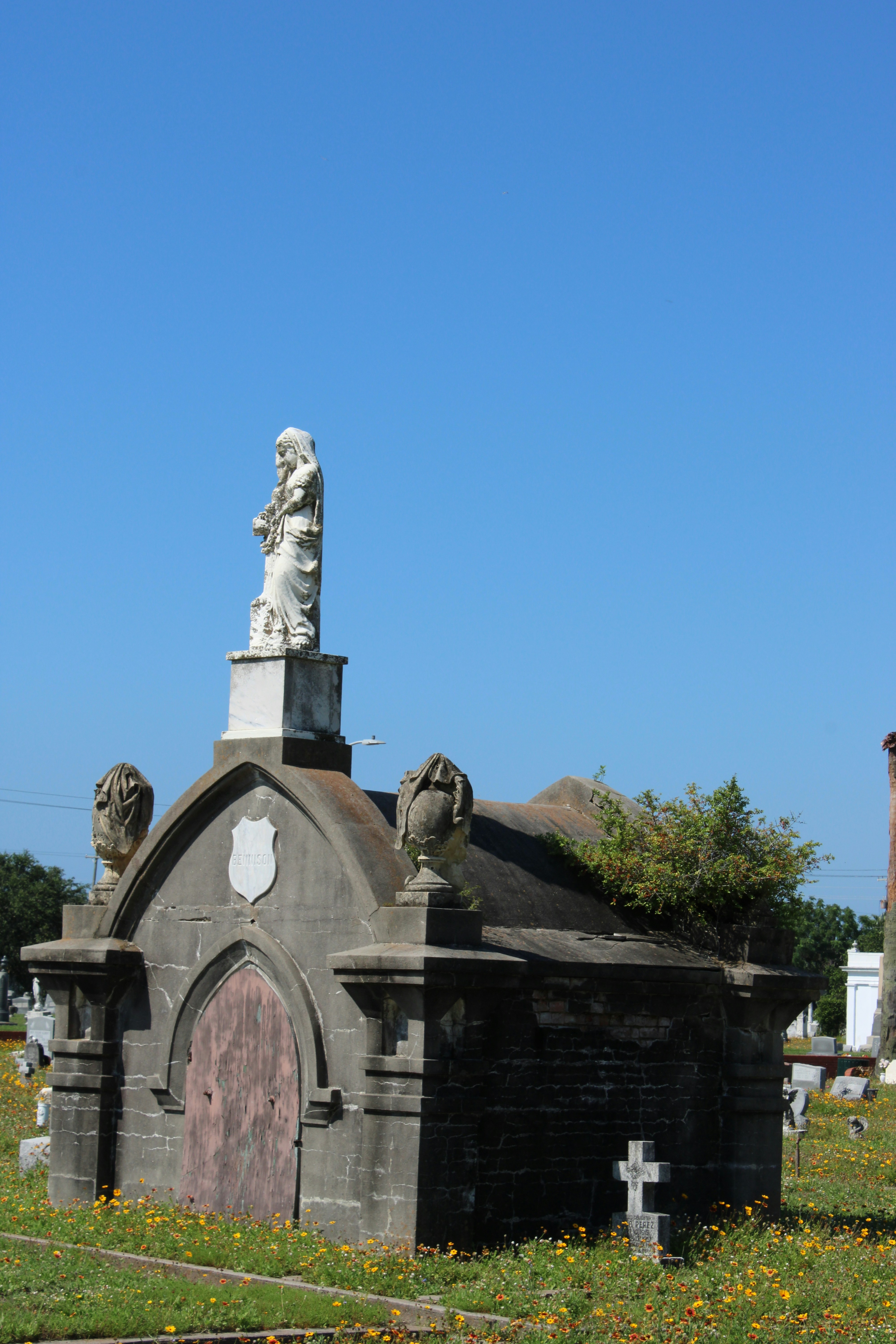 Statue Sentinel: A Sky-Above Granite Mausoleum