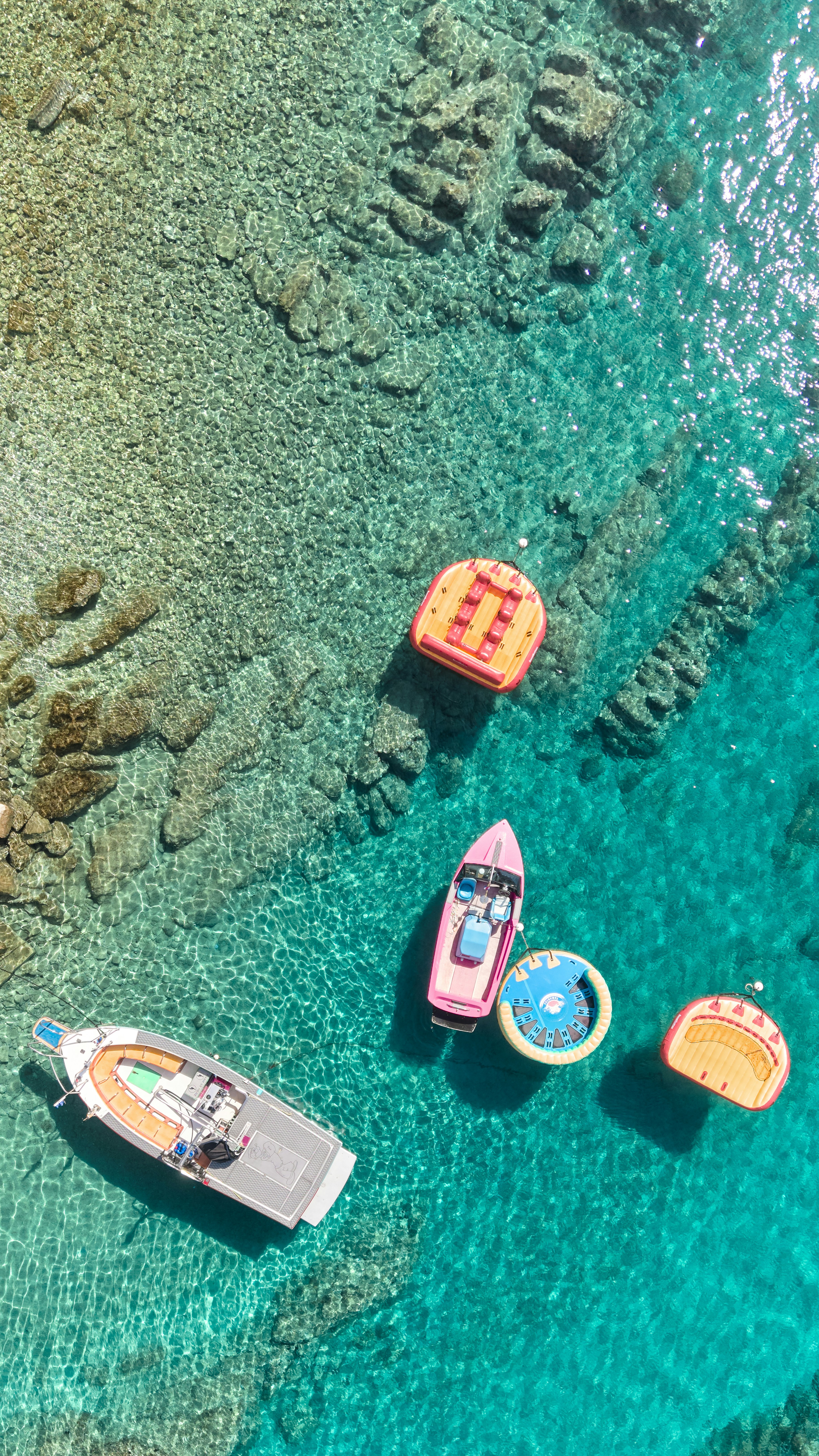Floating Palette: Colorful Boats Rest in Turquoise Waters