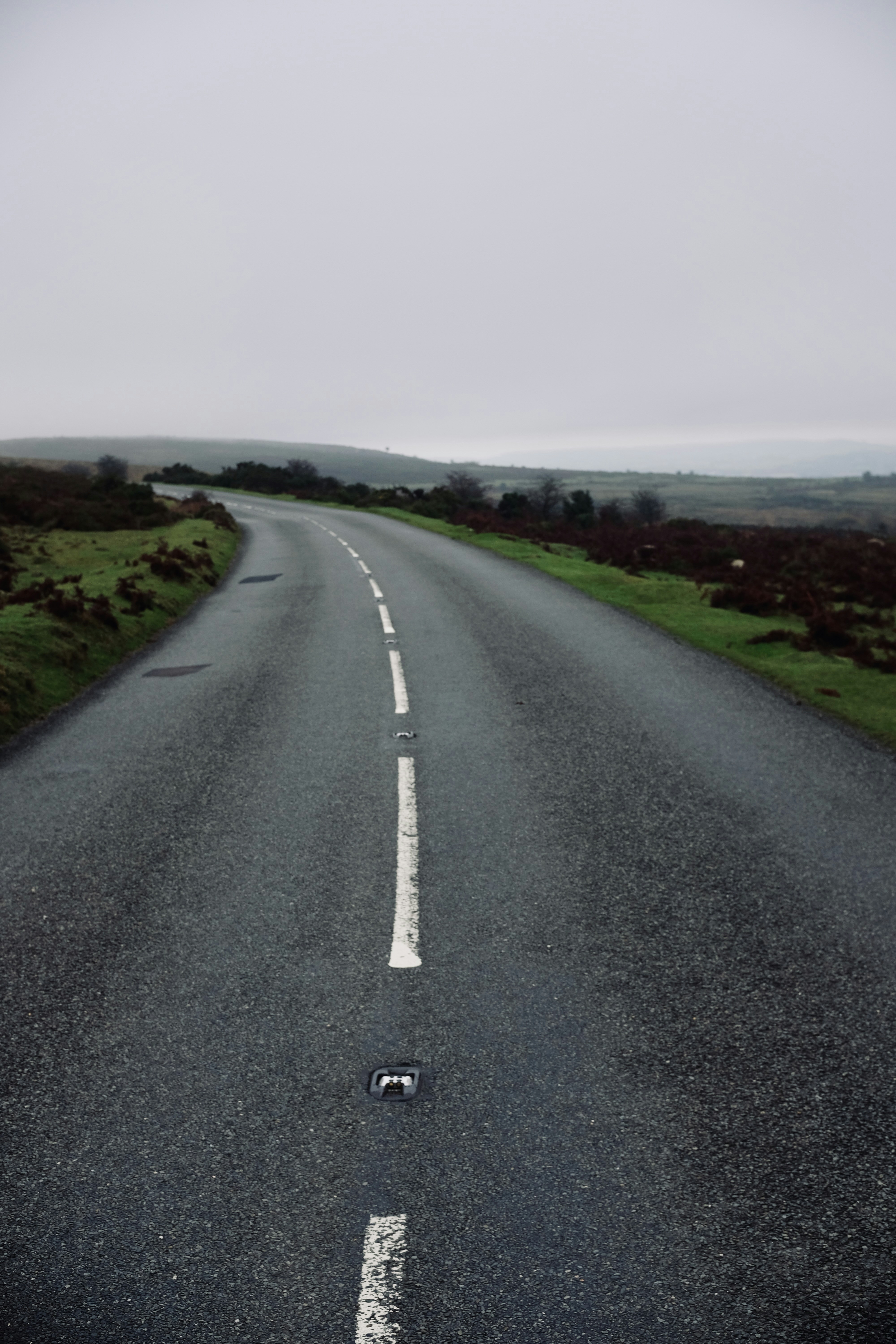 Landing Road: A Misty Path Through Open Countryside