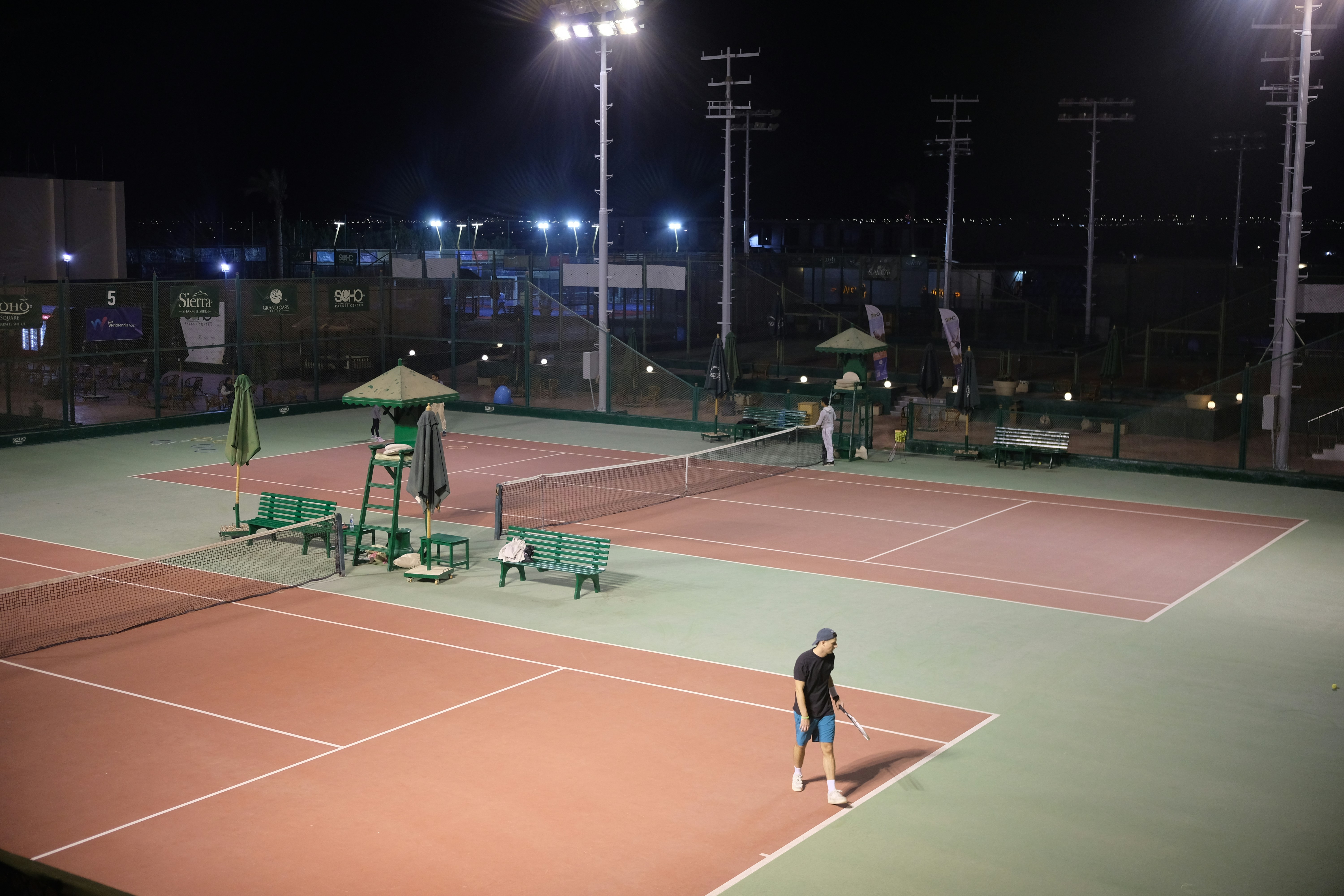 Night Tennis Court Quietly Alive Under Stadium Lights
