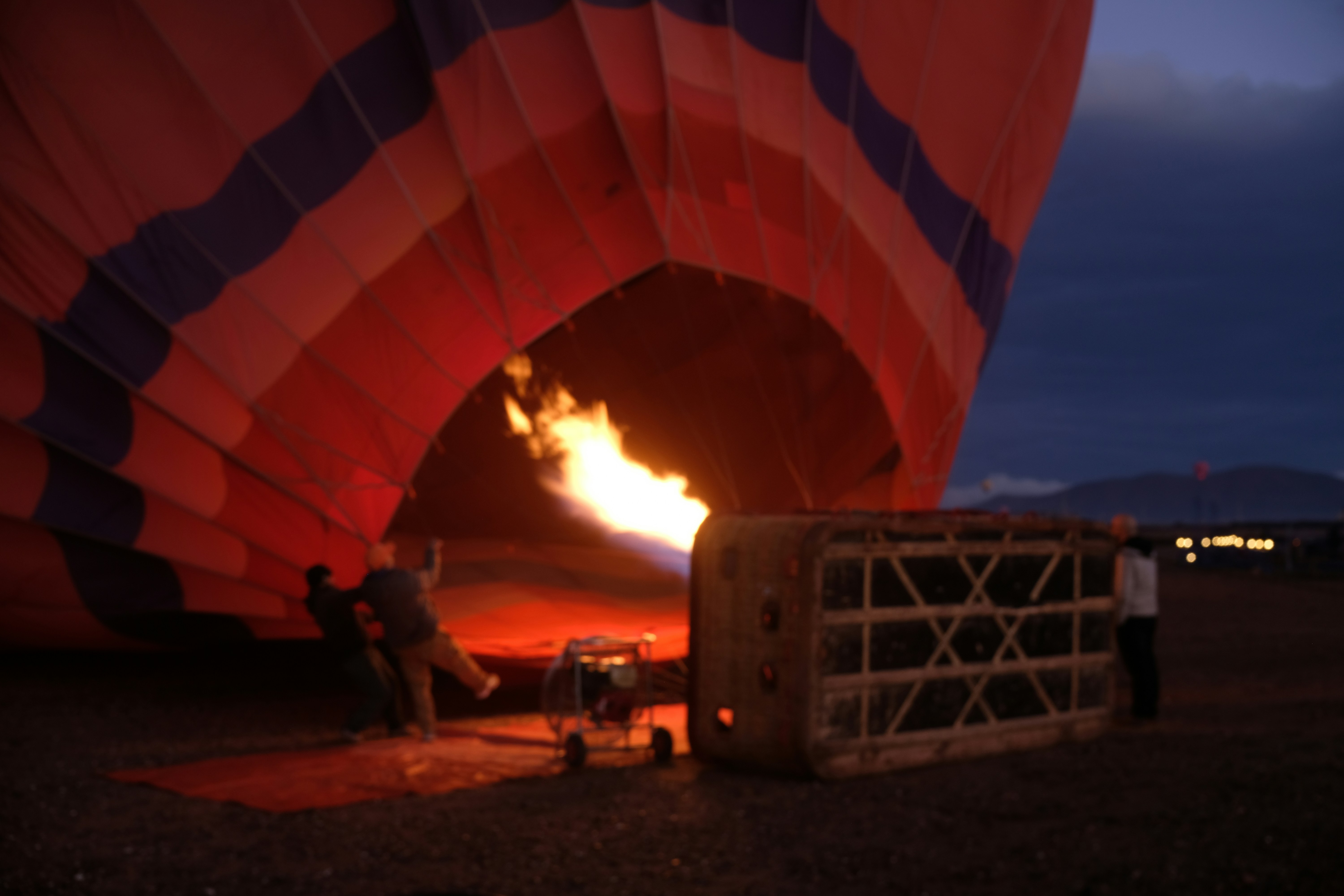 Flame in the Crescent: Balloon Launch at Dusk