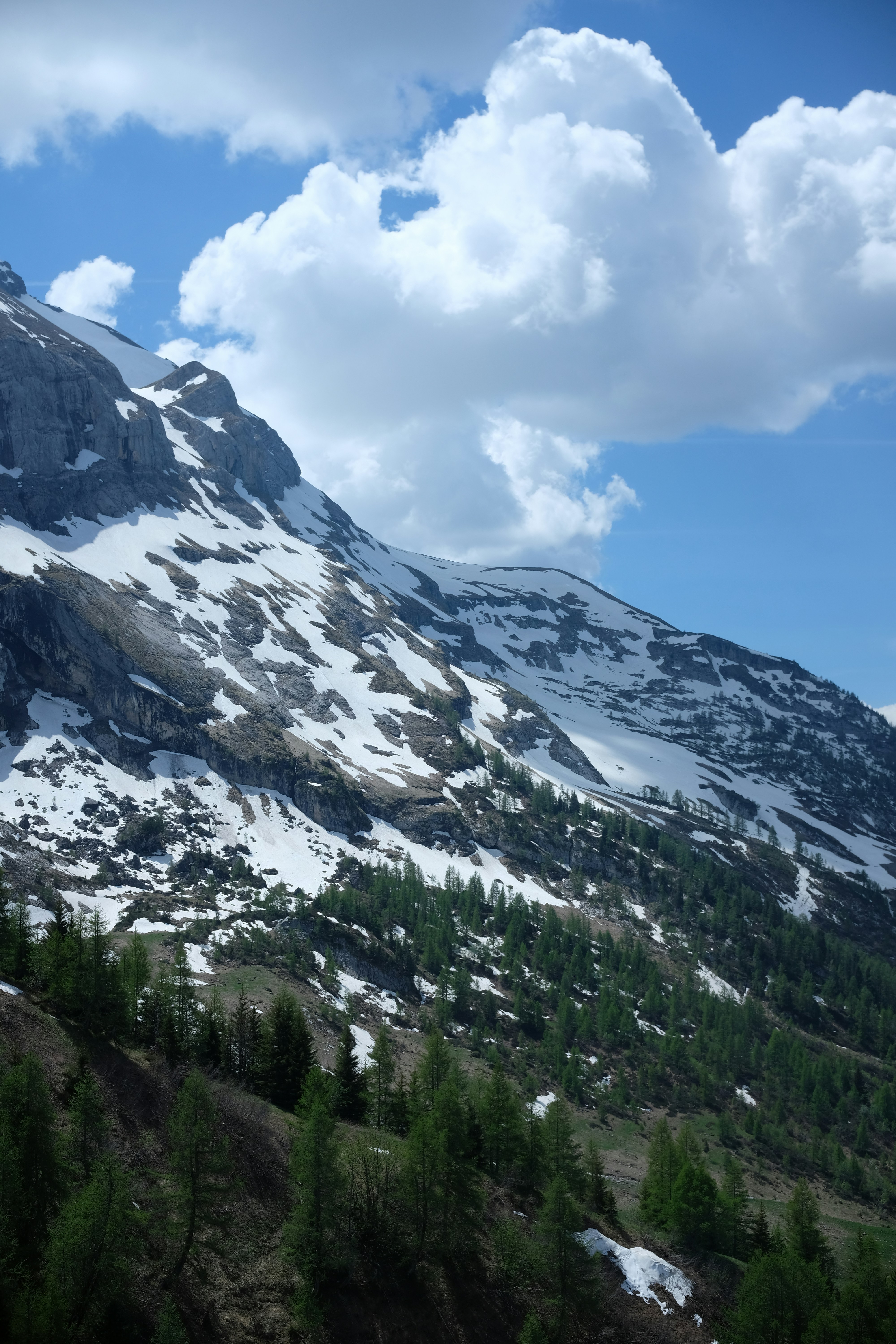Snow-dusted Alpine Ridge Under a Bright Blue Sky