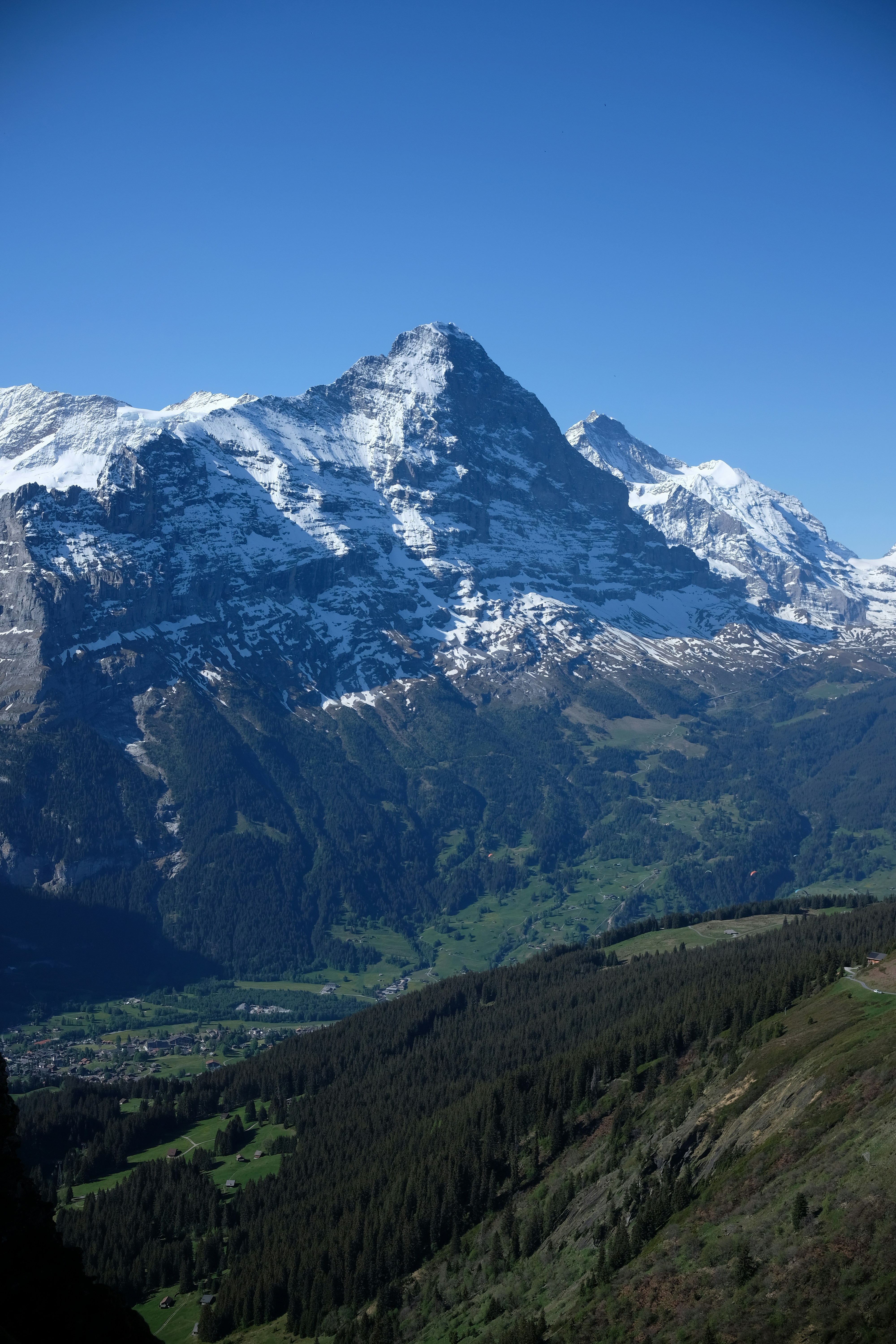 Snow-Crowned Summit Against a Clear Blue Wake
