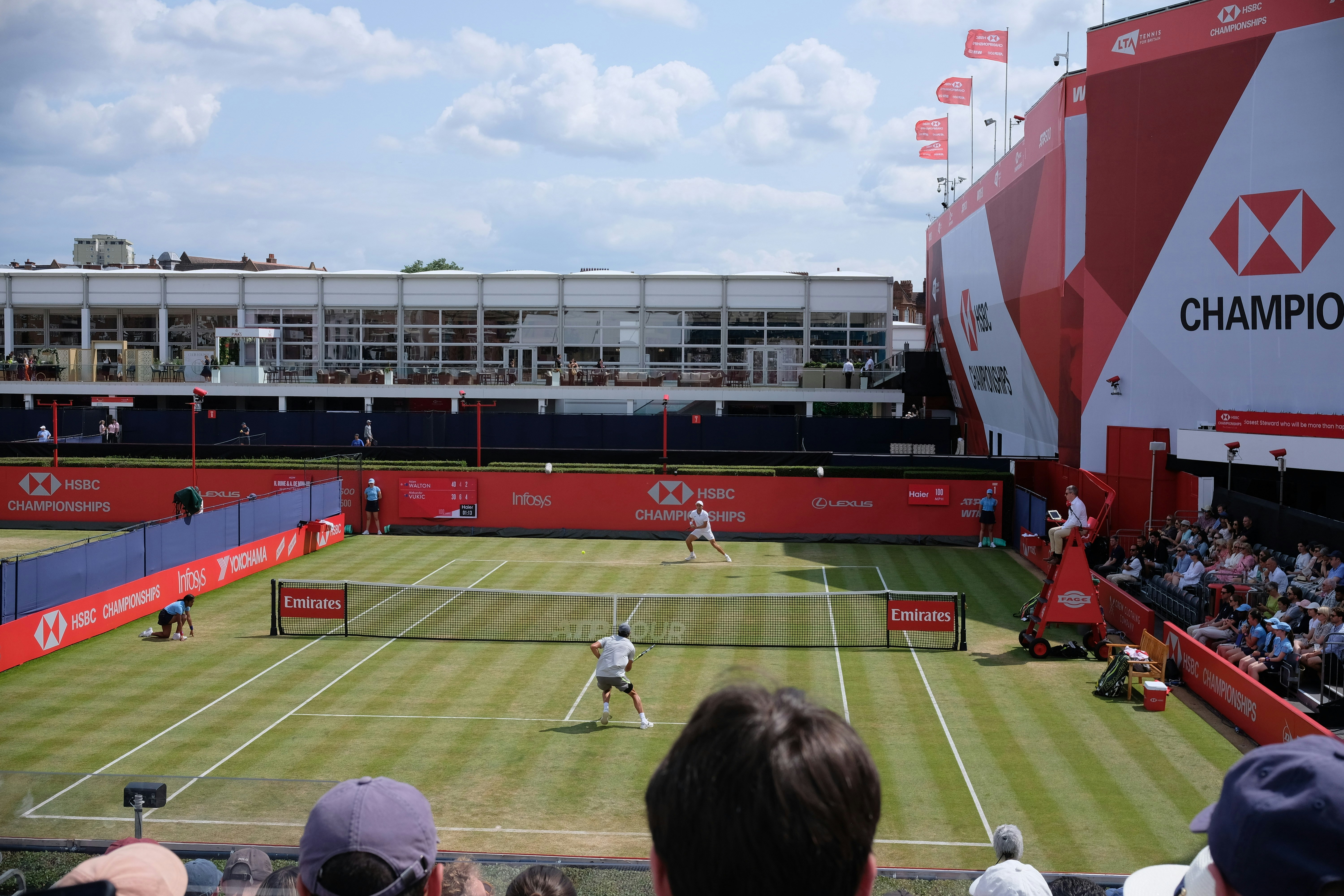 Center Court Rally: A Federer-esque Return at the Grass Courts