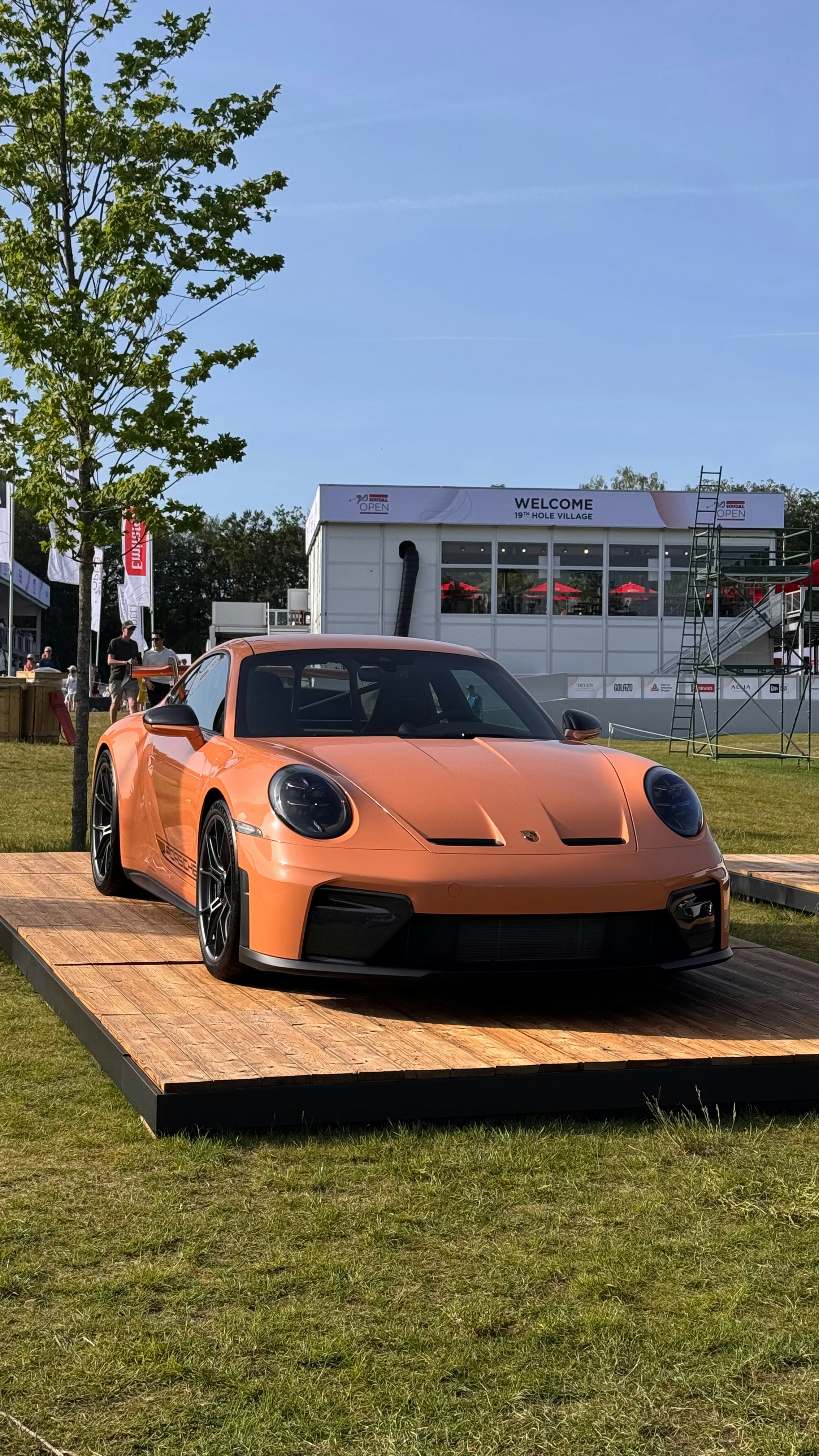 Peach Porsche on a Wooden Stage