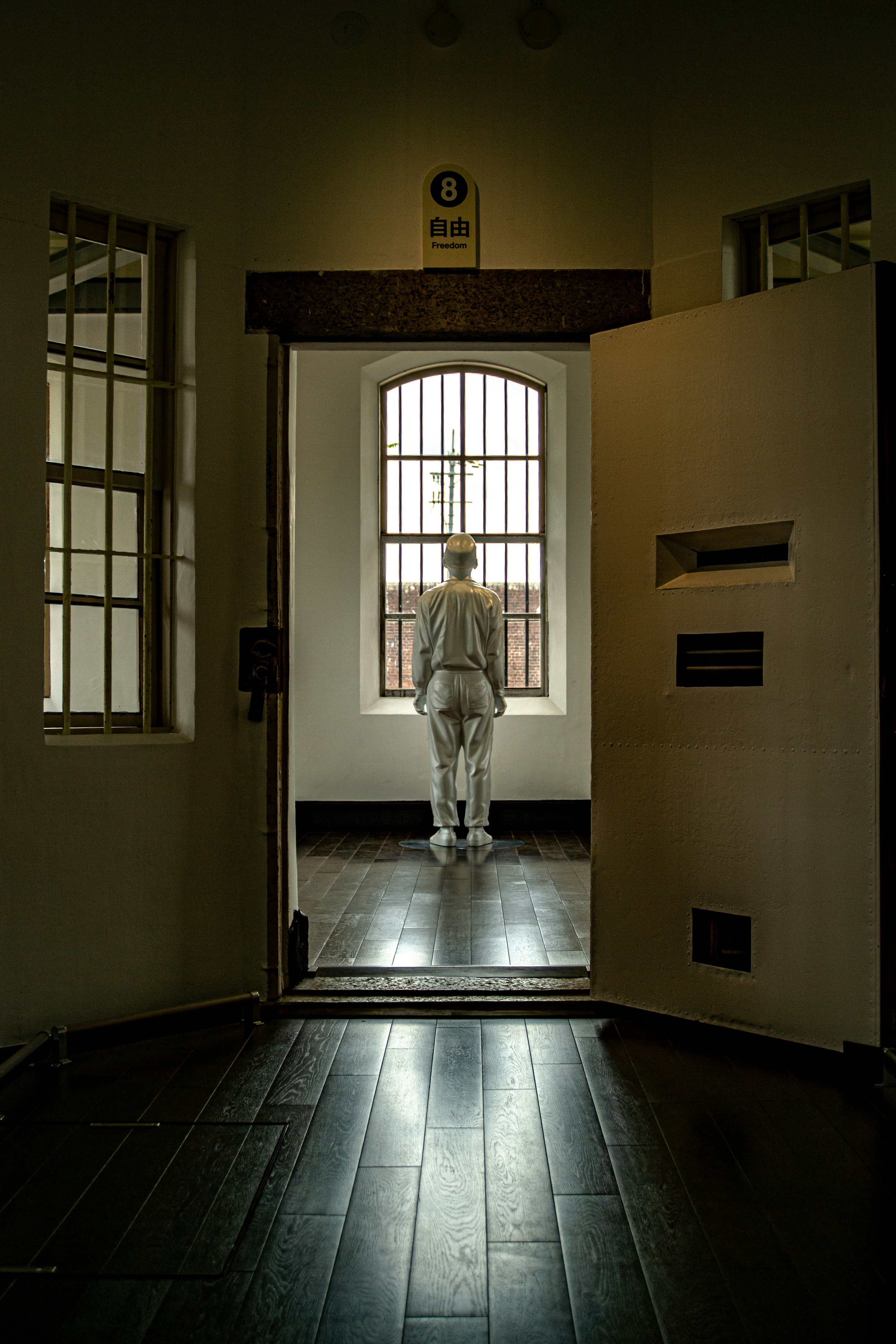 Stand at the Threshold: A Silhouette in the Windowed Light