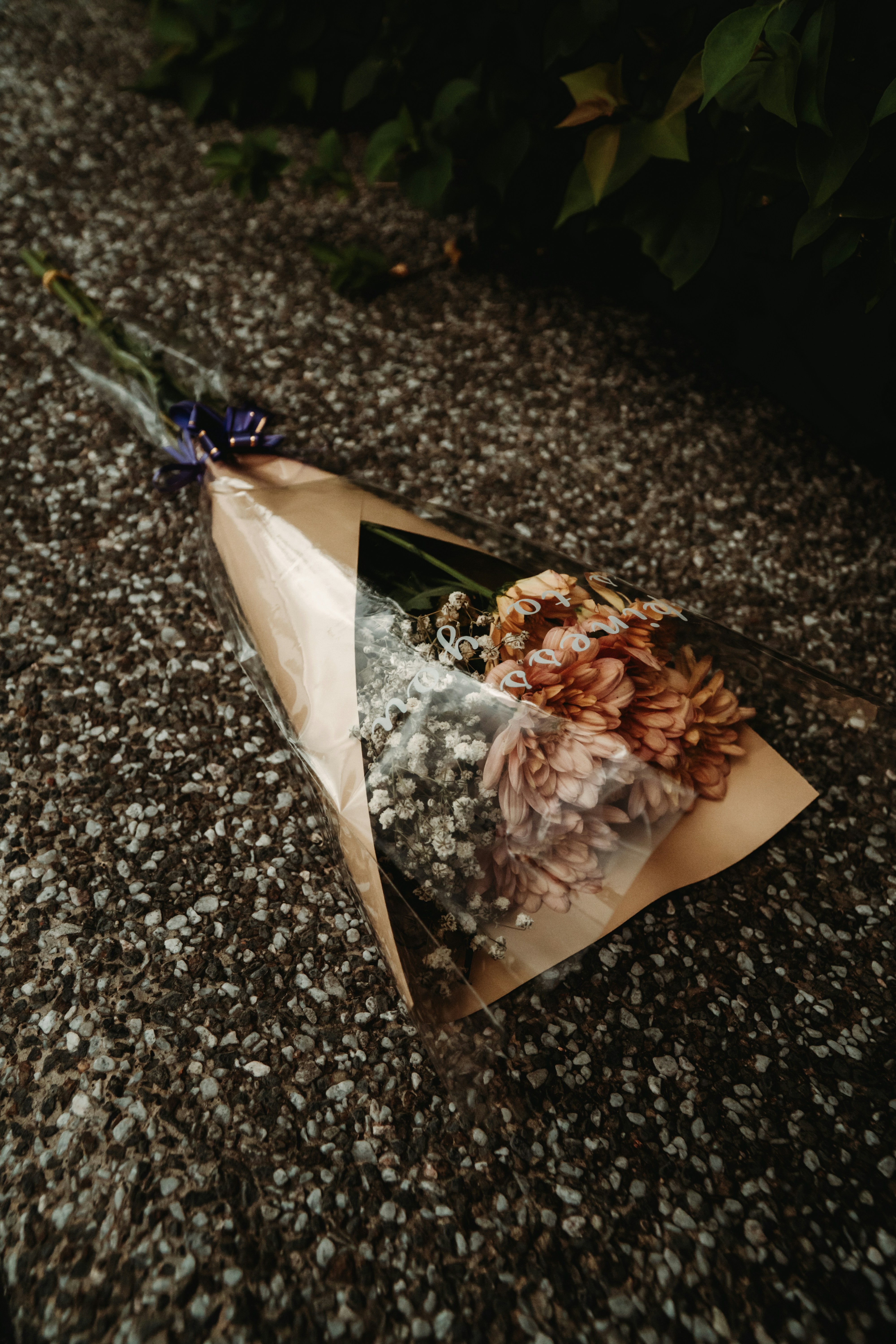 Bouquet on Gravel: a Quiet Sendoff in Night Tones