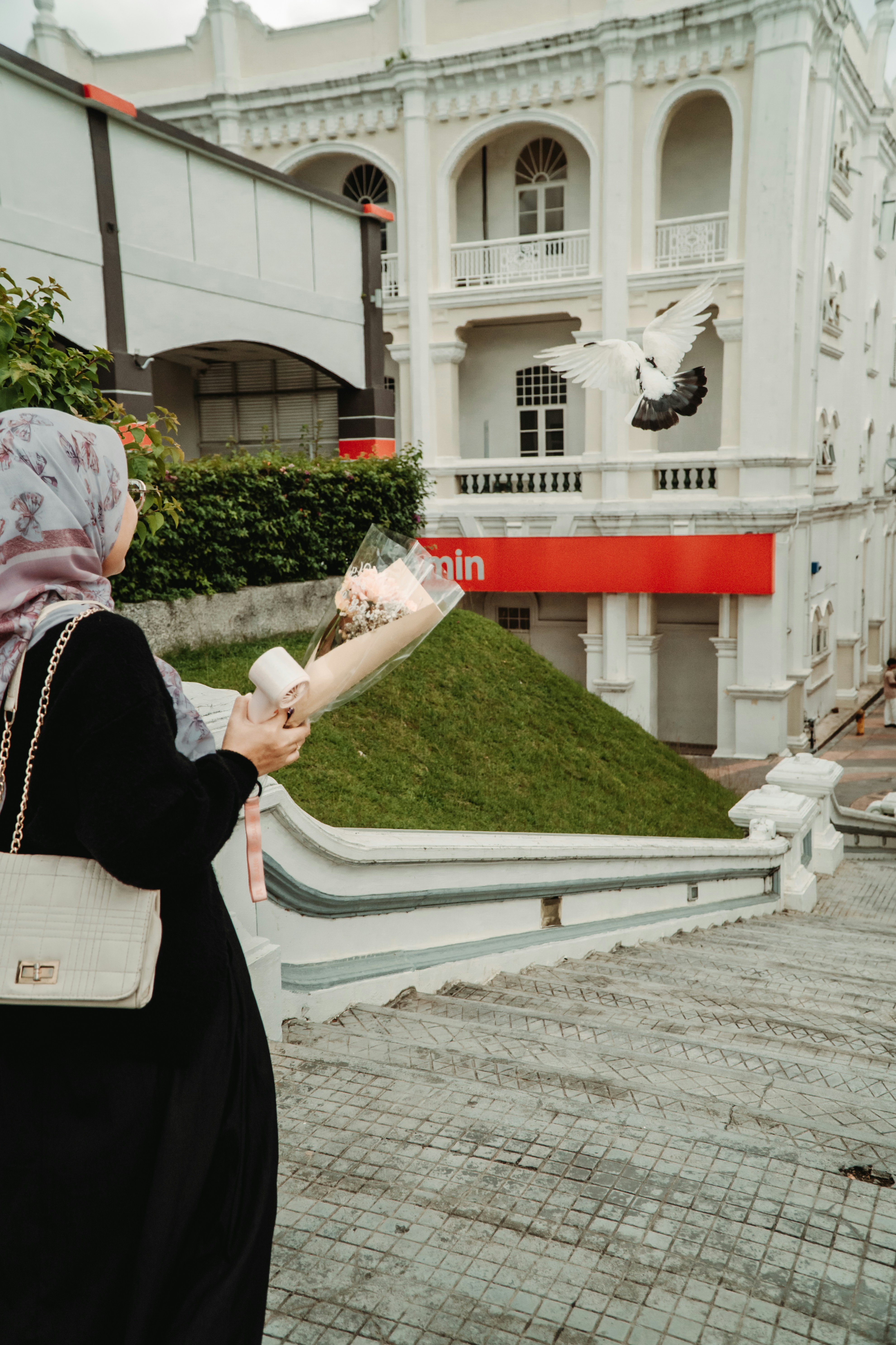 Bouquet and Flight: A Moment at the White Veranda