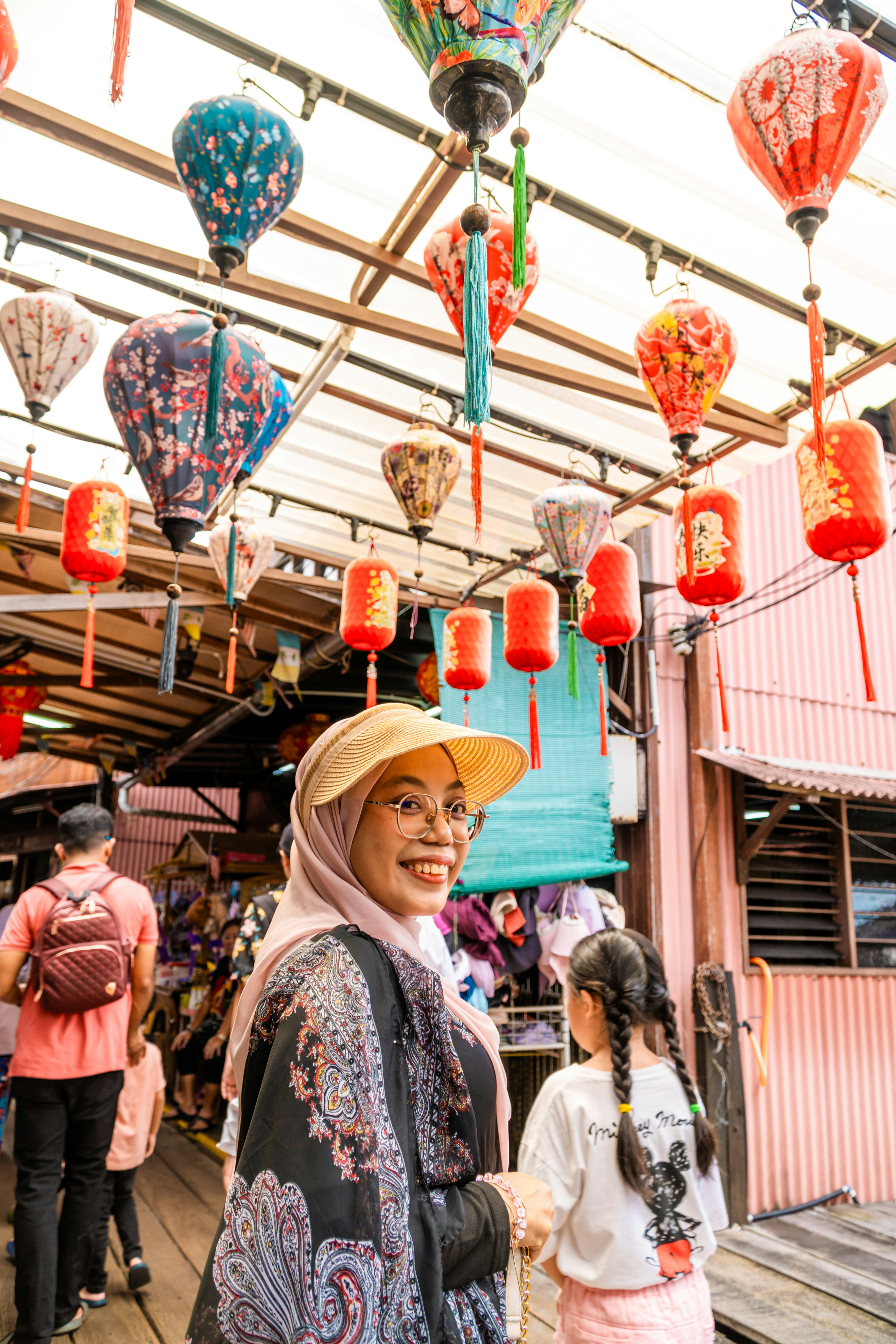 Smiling Street Portrait Under Lantern Light